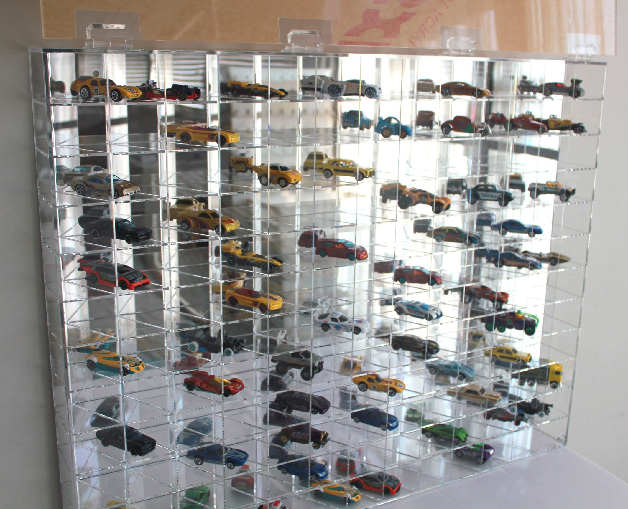 DisplayGifts Clear Acrylic Display Case for 1:64 Scale Hot Toy Cars Wheels Model Cars Display with 144 Compartments in 45 Degree Angle, Clear, UV Protect 22.5 X 30.4 X 3 Inches, Wall Mounted Storage