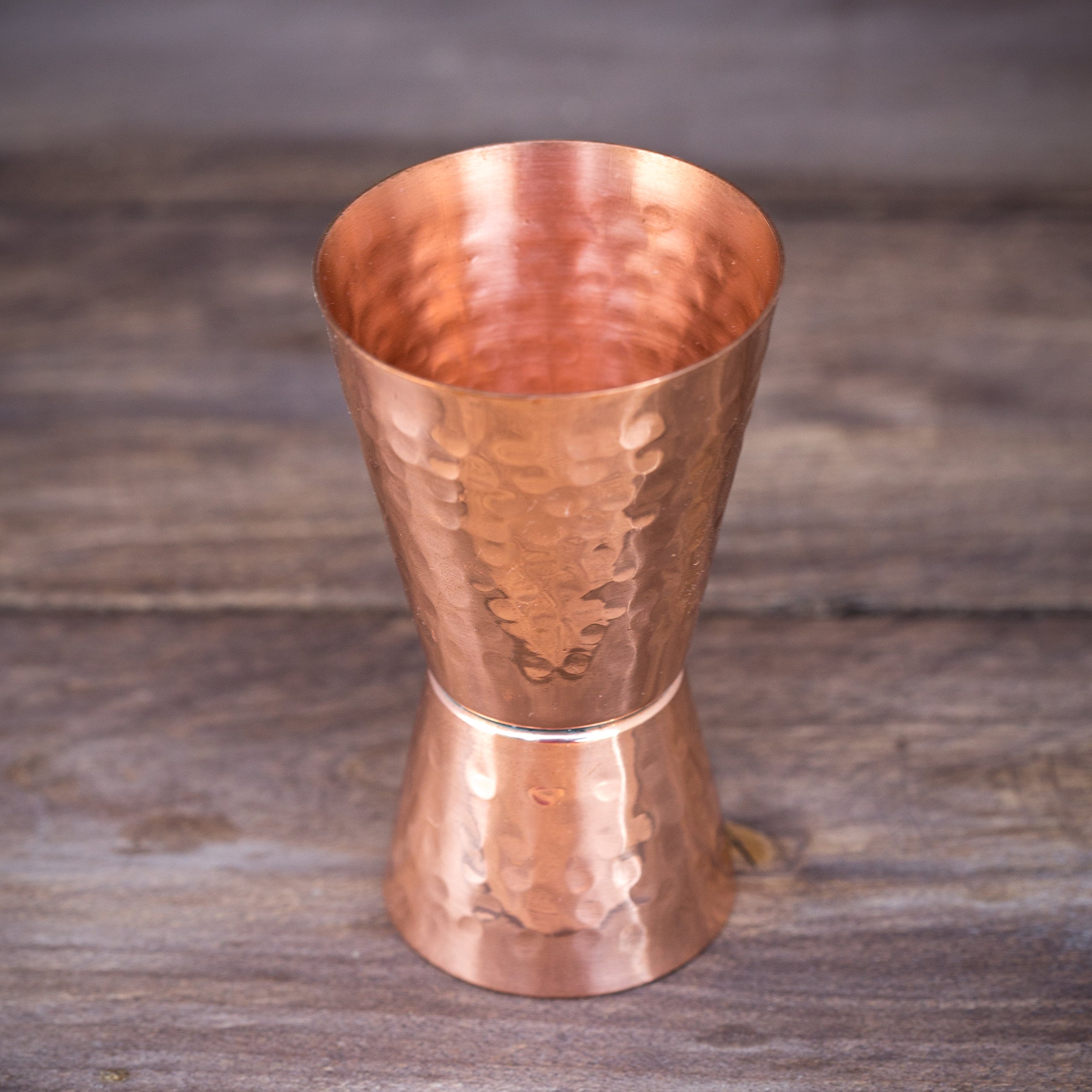 Copper jigger lacquered for the shine and to prevent tarnish. - Double 1oz/2oz copper measuring jigger for cocktail mixing. - Solid hammered copper 22G copper. - Copper shot glass for Moscow mule.