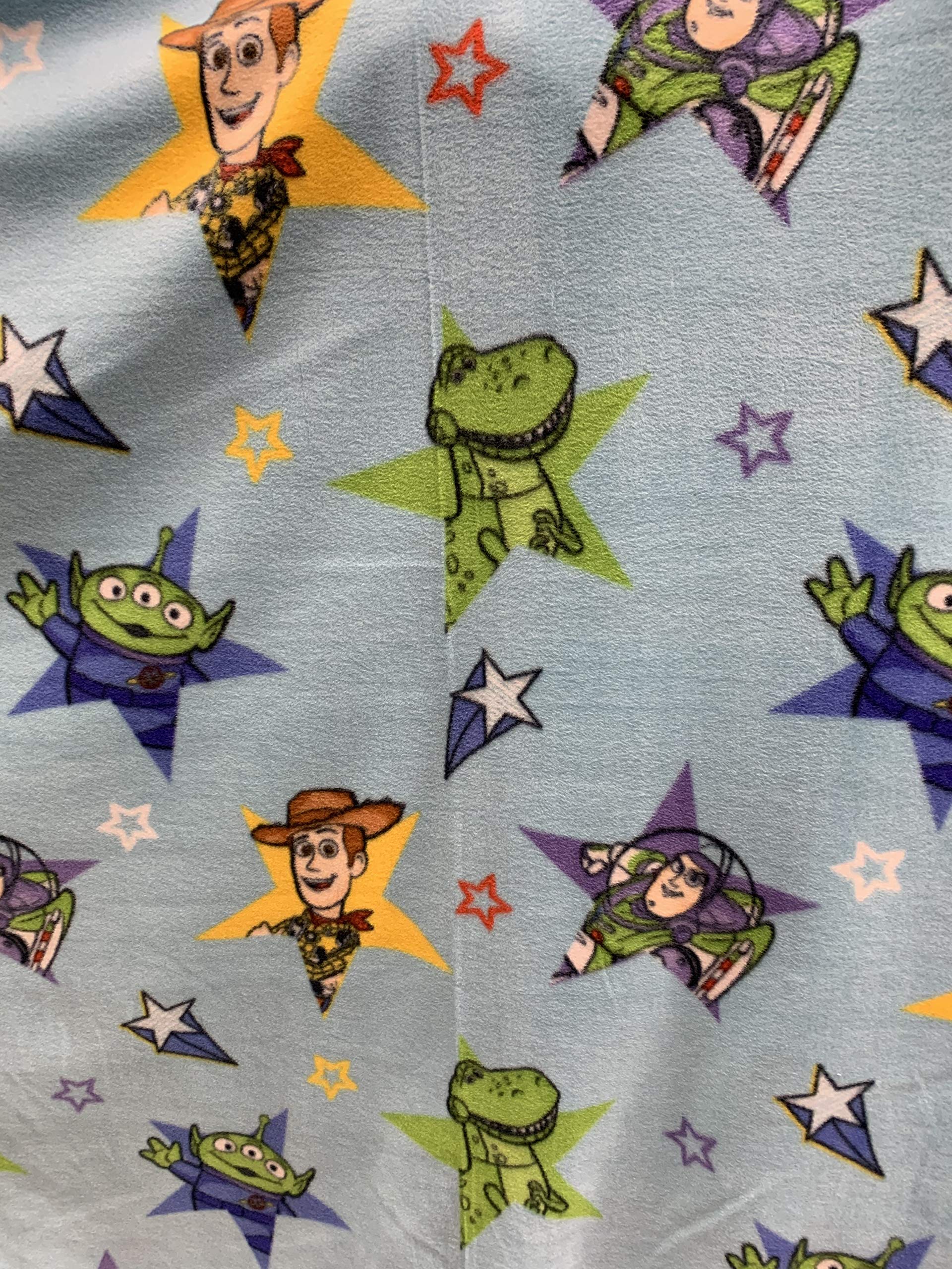 Disney Toy Story 4 Character Stars on Sky Blue Fleece from Springs Creative Buzz Light Year and Woody Fabric by The Yard