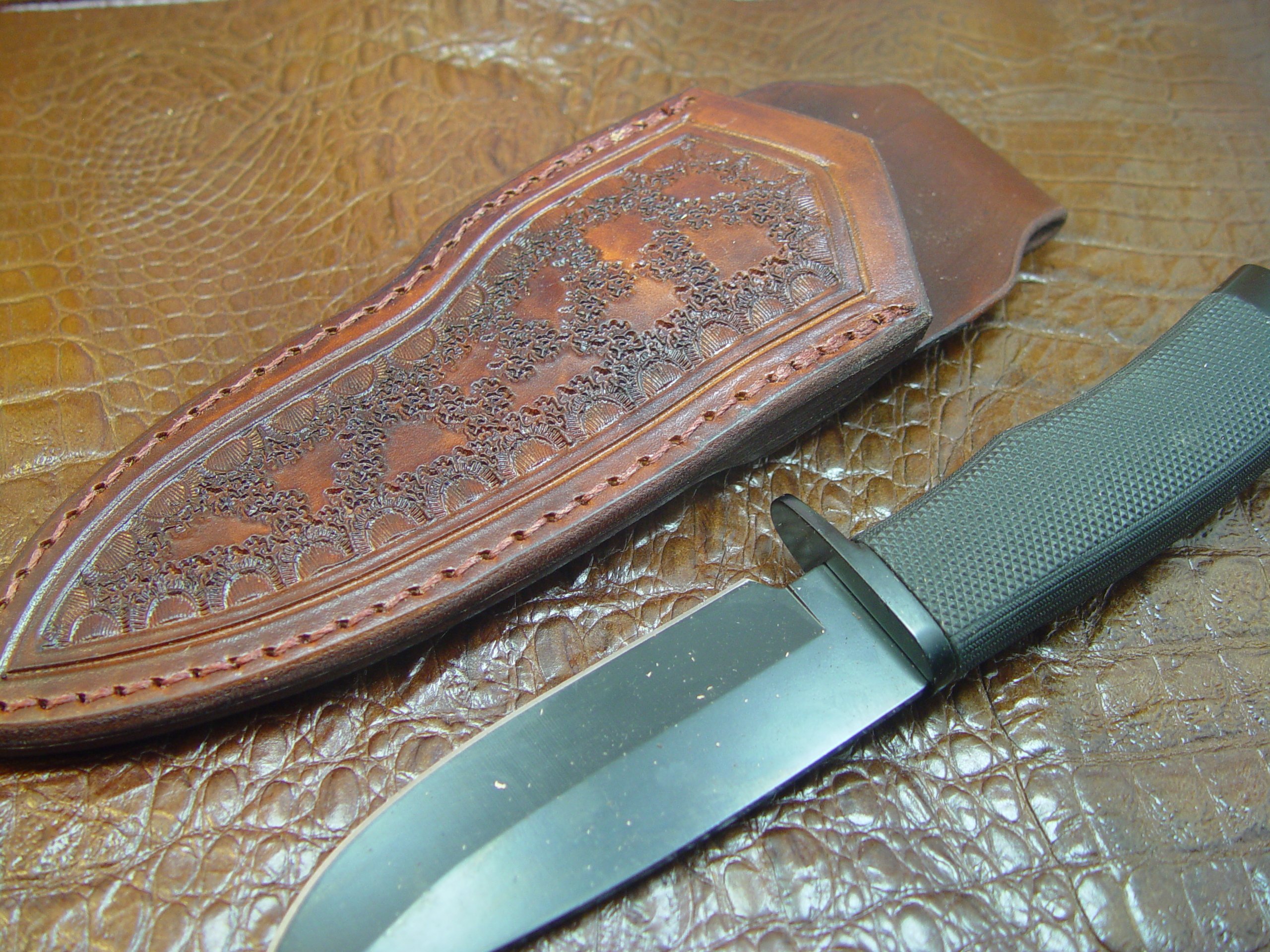 by Carl Thomas Jr. Custom Leather Knife Sheath That Fits a Buck 692 Vanguard or Zipper. Tooled and Dyed Dark Brown.