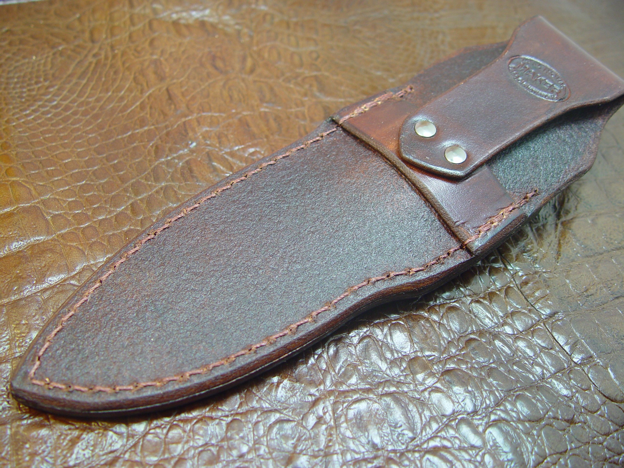 by Carl Thomas Jr. Custom Leather Knife Sheath That Fits a Buck 692 Vanguard or Zipper. Tooled and Dyed Dark Brown.
