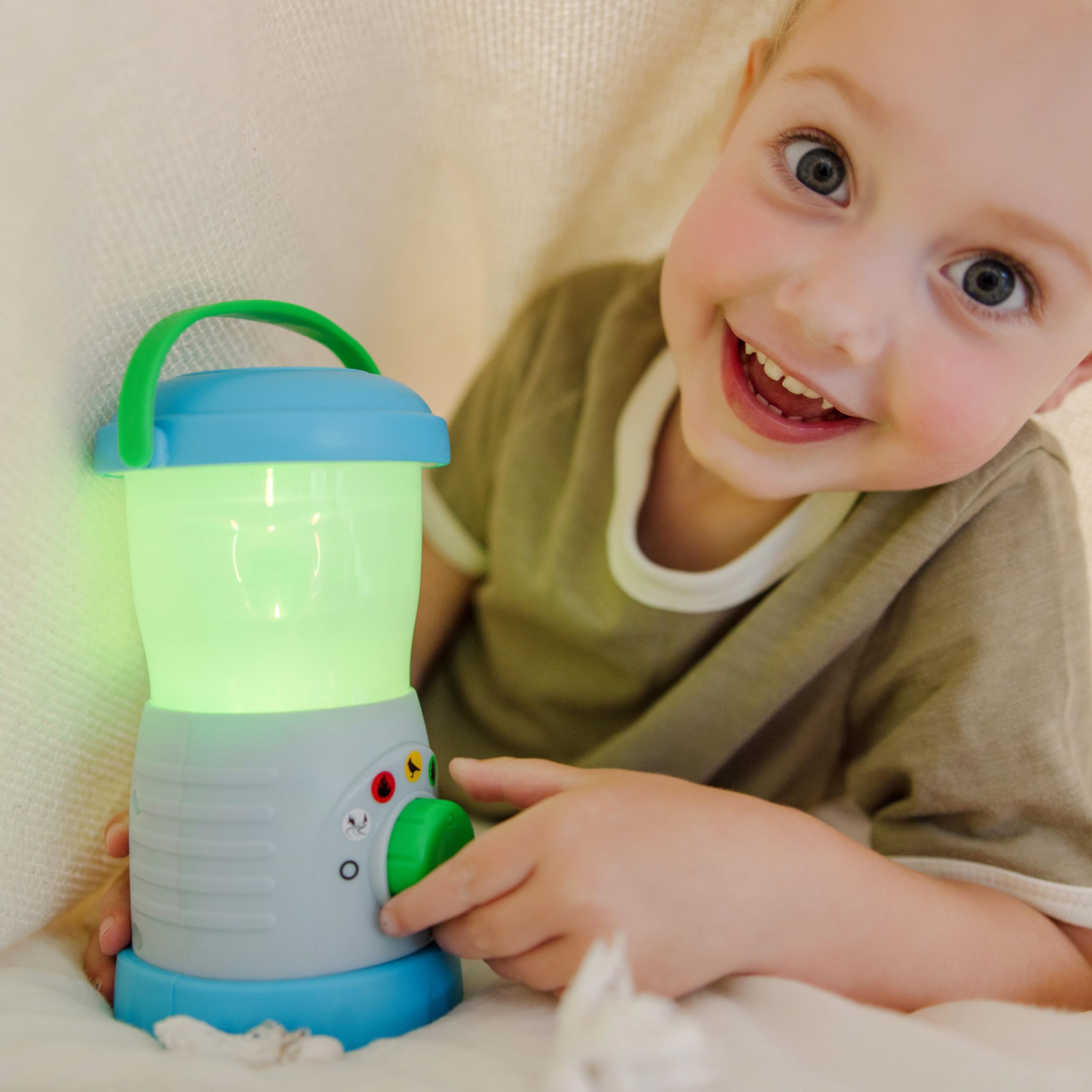 Melissa & Doug Let’s Explore Light & Sound Camping Lantern Play Set, lantern, 3 double-sided cards to set the scene (cards store in bottom of lantern), collectible medallion