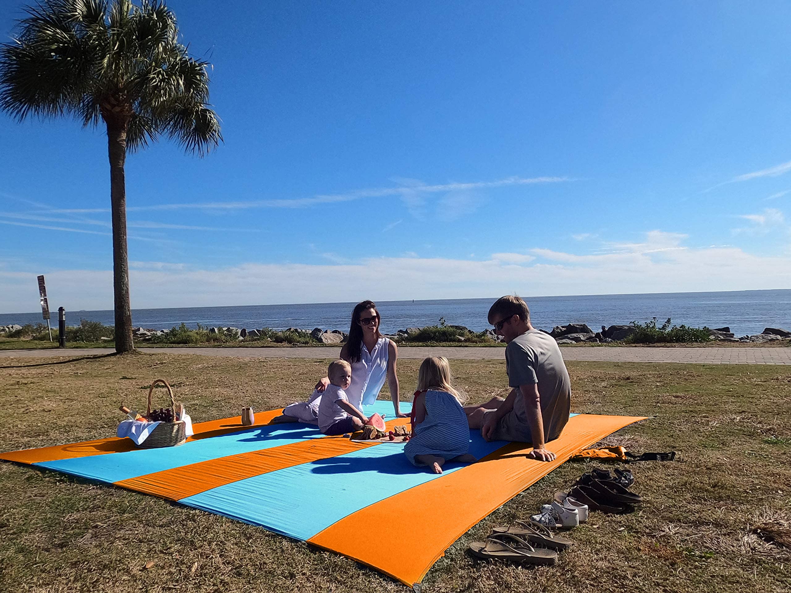AQUATUS Premium XXL Beach Blanket Sandproof Water Resistant Quick Dry Mat 10ft by 9ft for 1-8 Adults with 4 Metal Stakes, 4 Corner Pockets, Secure Clip and Strap, and Attached Bag