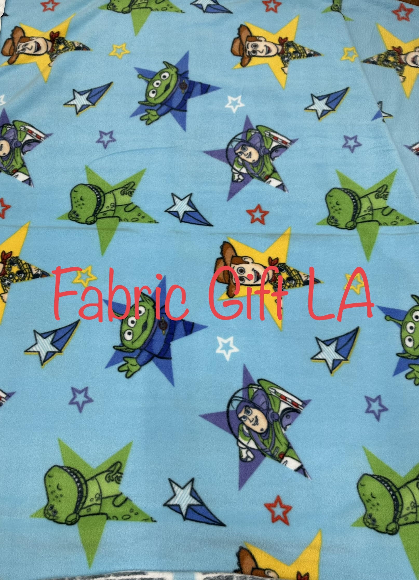 Disney Toy Story 4 Character Stars on Sky Blue Fleece from Springs Creative Buzz Light Year and Woody Fabric by The Yard