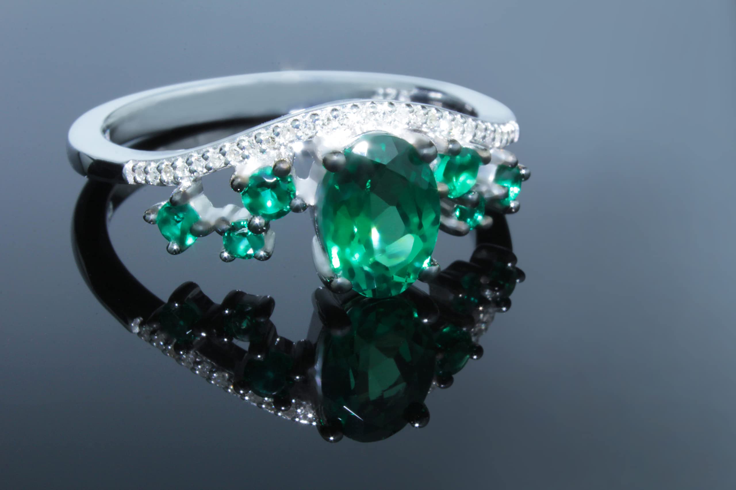 Belantina Heartland By Beverley Mitchell .925 Sterling Silver 7x5mm Oval Cut Lab-Created Emerald & Diamond Accented Curved Statement Ring (H-I, I2-I3) - Size 7