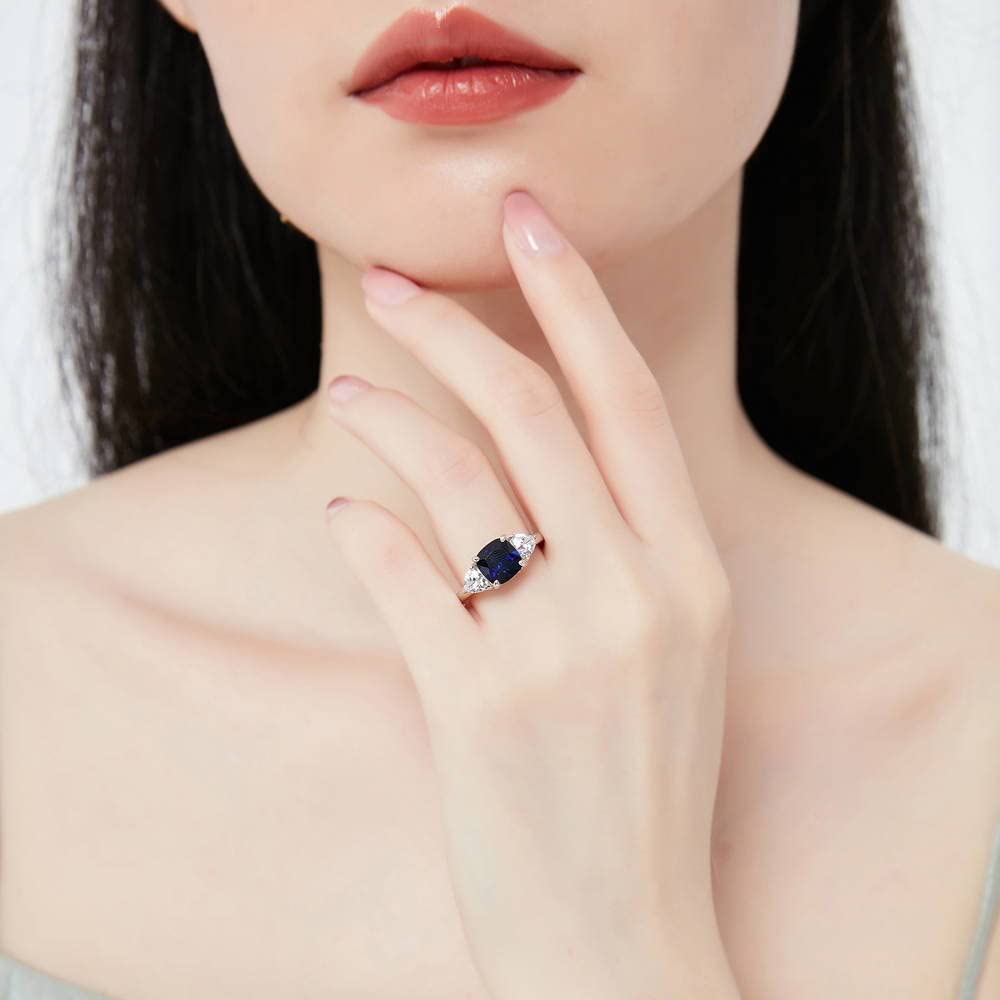BERRICLE Sterling Silver 3-Stone Wedding Engagement Rings Simulated Blue Sapphire Cushion Cut Cubic Zirconia CZ Anniversary Ring for Women, Rhodium Plated Size 9