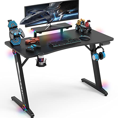 JOY worker RGB Gaming Desk 47 Inch with Led Lights, Music Sync Computer Gamer Desk, Carbon Fiber Surface PC Gaming Desk with Monitor Stand, Ergonomic Z Shaped Gaming Table with Plug Board Holder,Black