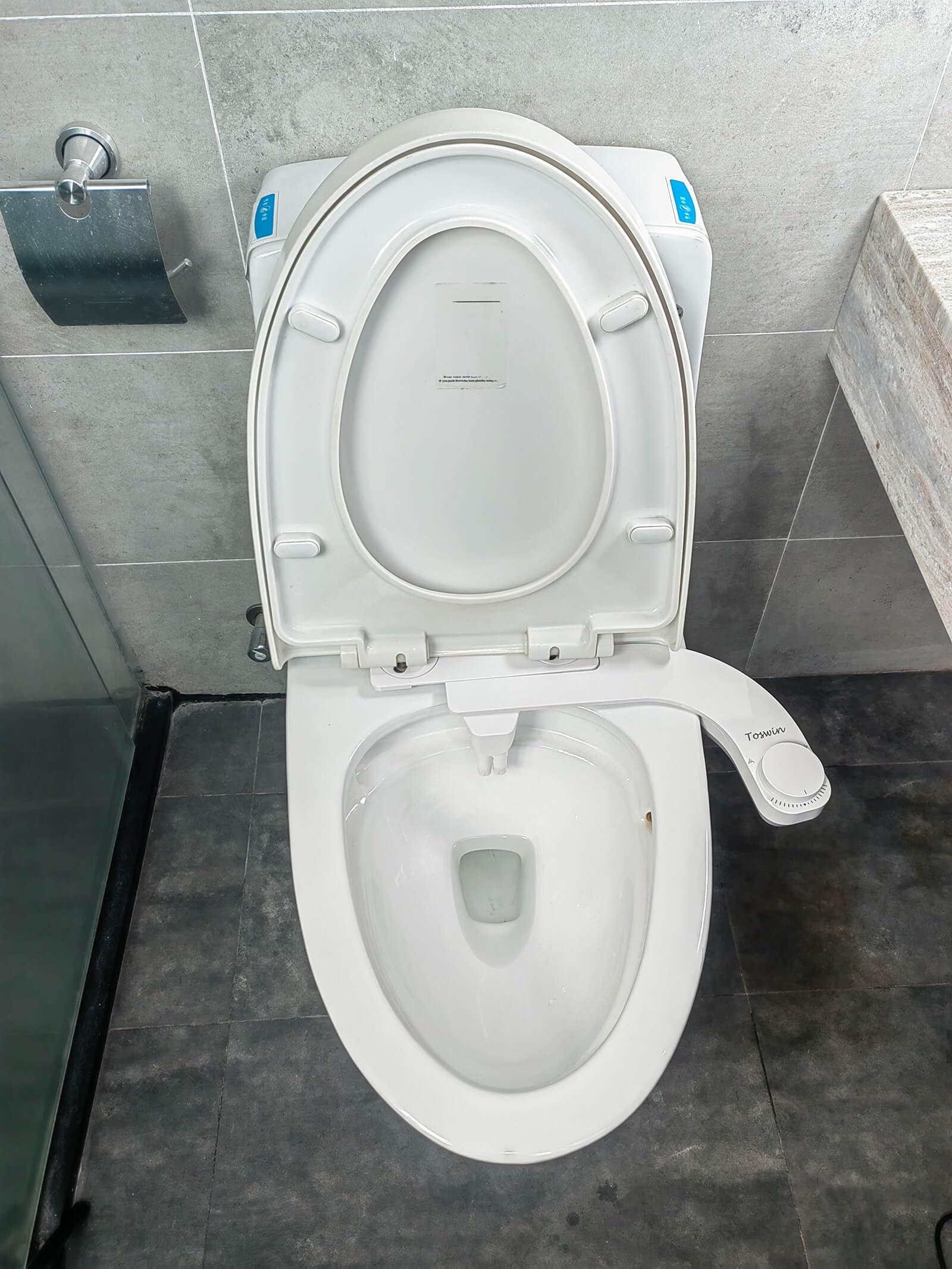 Toswin Left Handed Bidet Left Hand Bidet Ultra Slim Bidet Left Side Control Clear Rear Bidet Attachment for Toilet with Dual Front & Rear Nozzles and Adjustable Water Pressure -White Knob