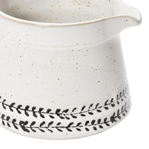 Creative Co-Op Stoneware Creamer with Debossed Pattern, Antique White and Blue Reactive Glaze, 6" L x 4" W x 4" H