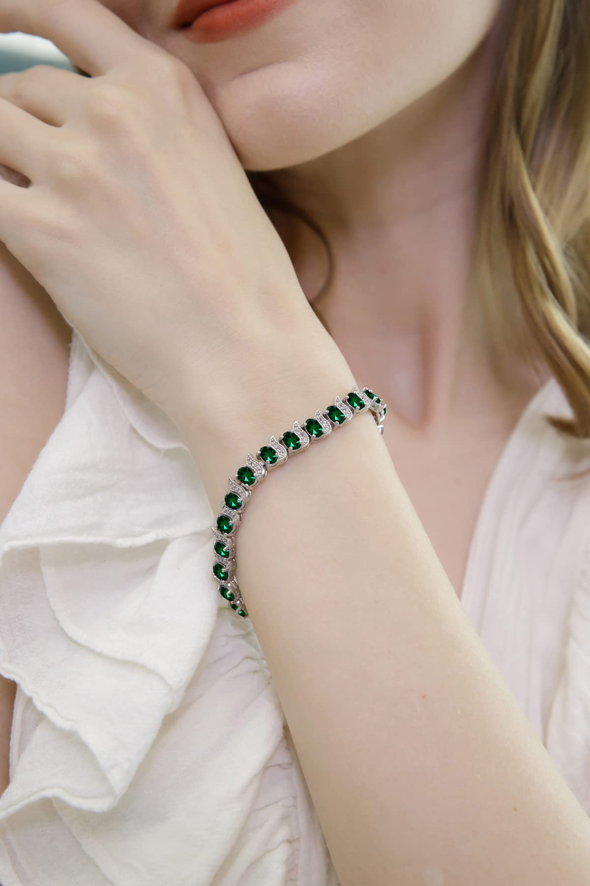 B. BRILLIANT Sterling Silver Simulated Emerald 6x4mm Oval and S Tennis Bracelet with White Topaz Accents