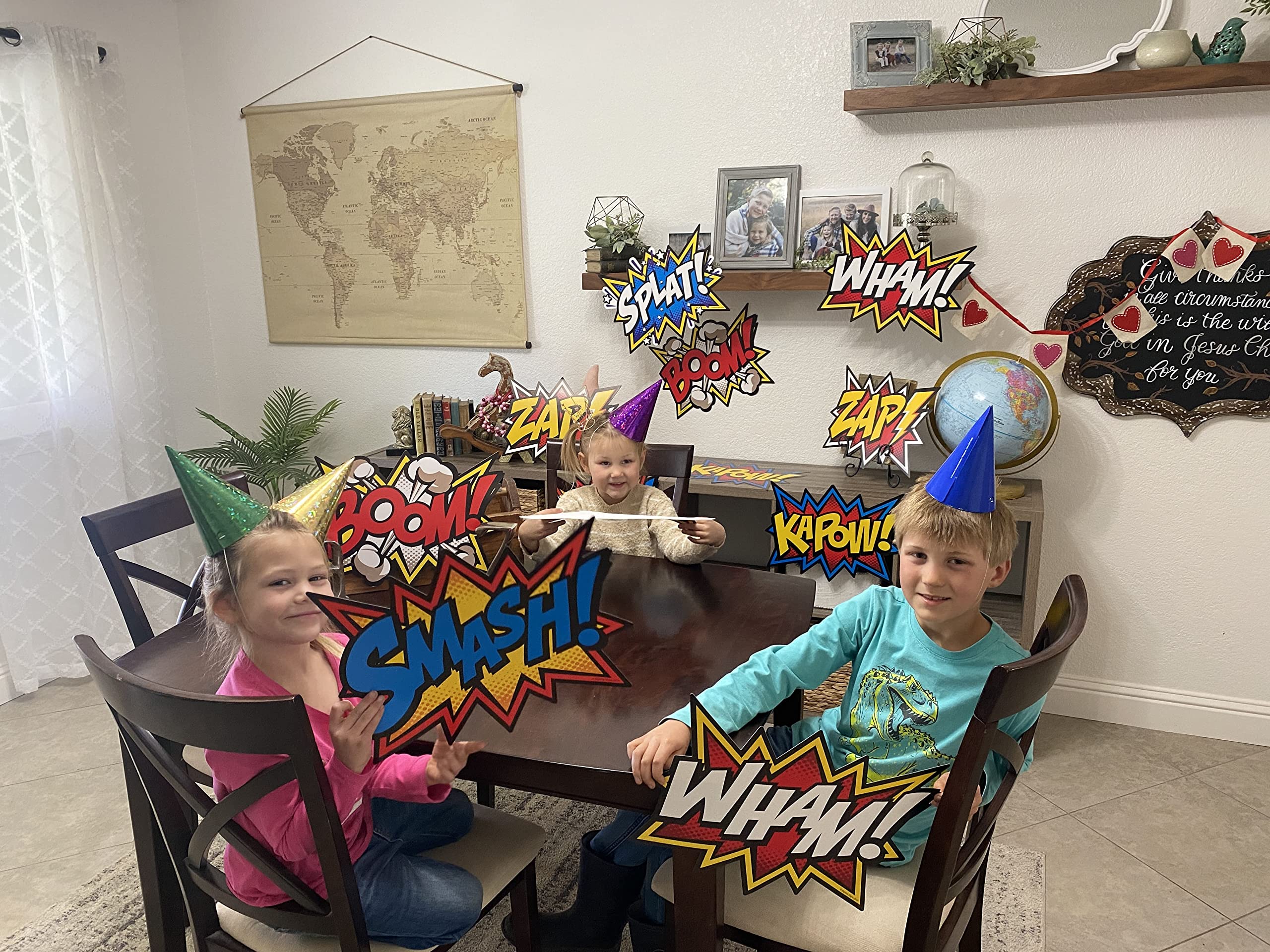 Bigtime Signs XL Superhero Backdrop with 6 Comic Action Word Photo Booth Props - Compliments Any Superhero Party Decorations - 4 x 6 ft - Cityscape Superhero Birthday Decorations Hangs on Wall Easily