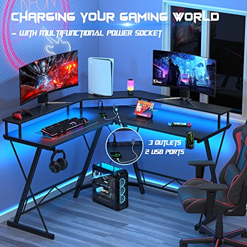 HYTXEN Gaming Desk with Led Lights, L Shaped Corner Computer Desk with Power Strip, Carbon Fiber Surface Gaming Table with Monitor Stand&Cup Holder, Headphone Hook, Graphite Black