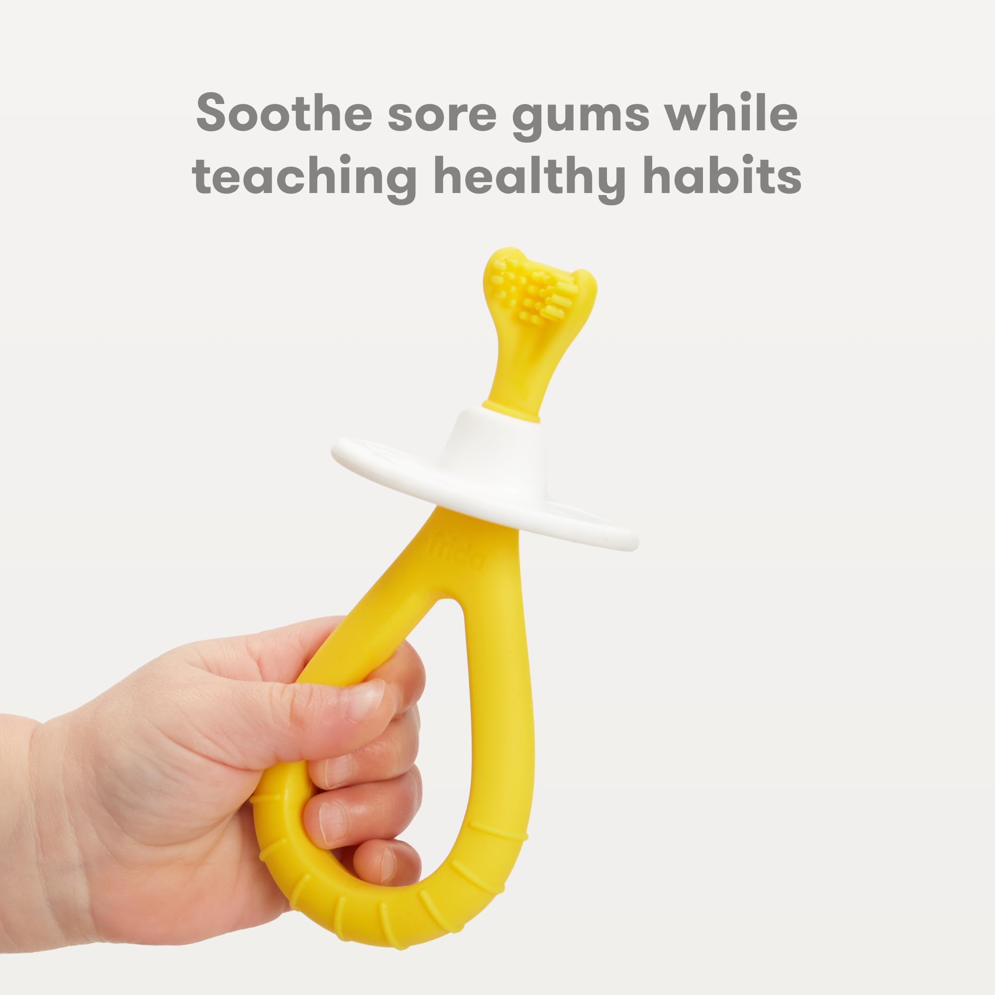 Frida Baby Training Toothbrush | Baby Toothbrush for 6-18 Months, Easy-Grip Handle, Triple Angle Bristles