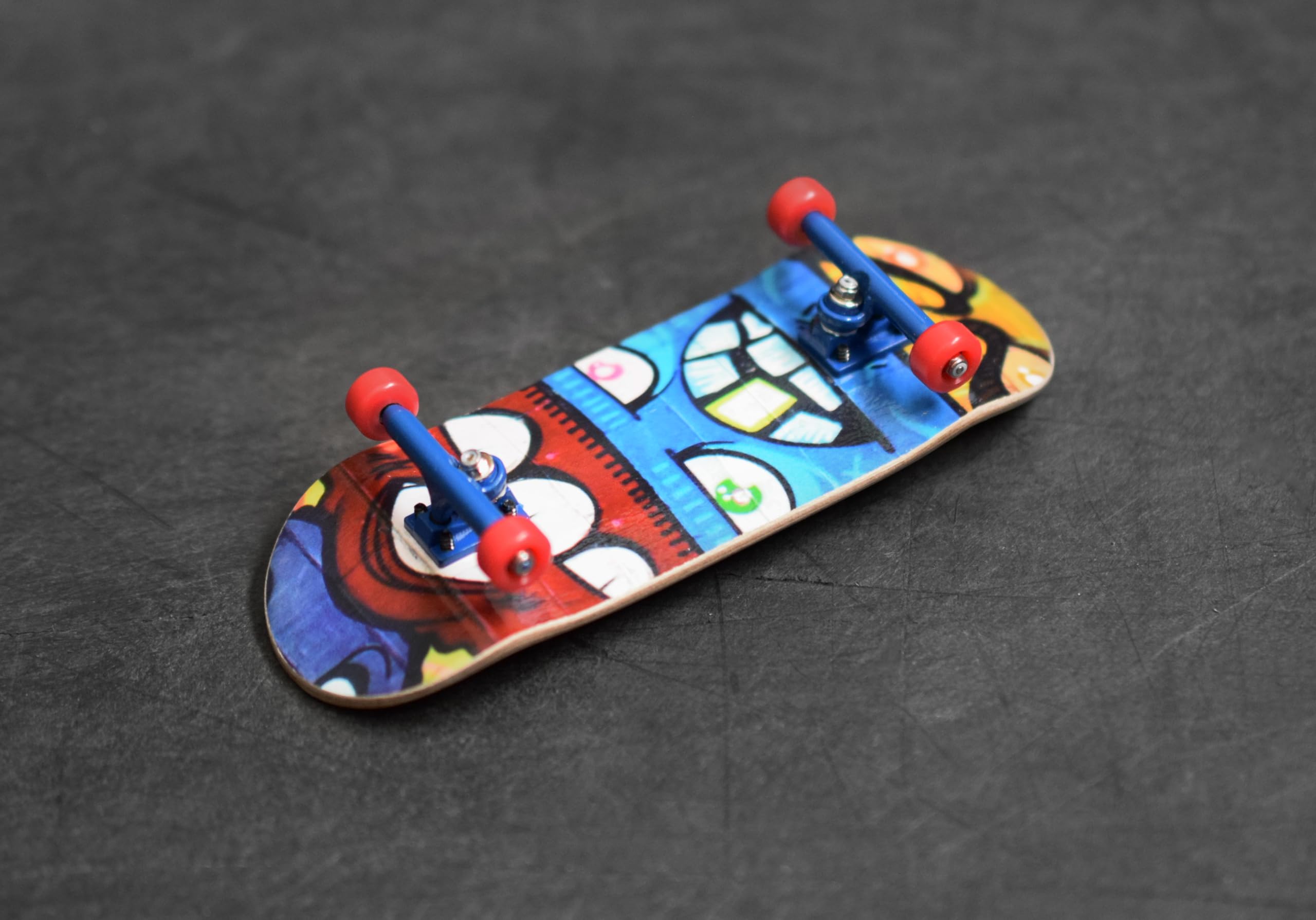 Teak Tuning 34mm Pro Fingerboard Heat Transfer Graphic Complete - Fully Assembled with Pro Level Parts - Pro Shaped Wood Deck (34x97mm), UltraSpin Wheels, Prodigy Trucks - Stack 'Em Monsters