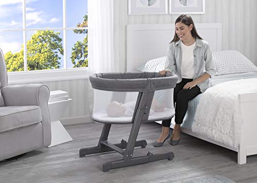 Simmons Kids Oval City Sleeper Bedside Bassinet - Adjustable Height Portable Crib with Wheels & Airflow Mesh, Grey Tweed 31.5x19.7x30 Inch (Pack of 1)