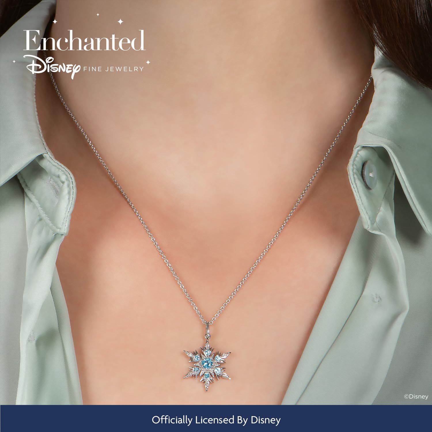 Jewelili Enchanted Disney Fine Jewelry Sterling Silver 1/10 Cttw Diamond and Swiss Blue Topaz Elsa Pendant