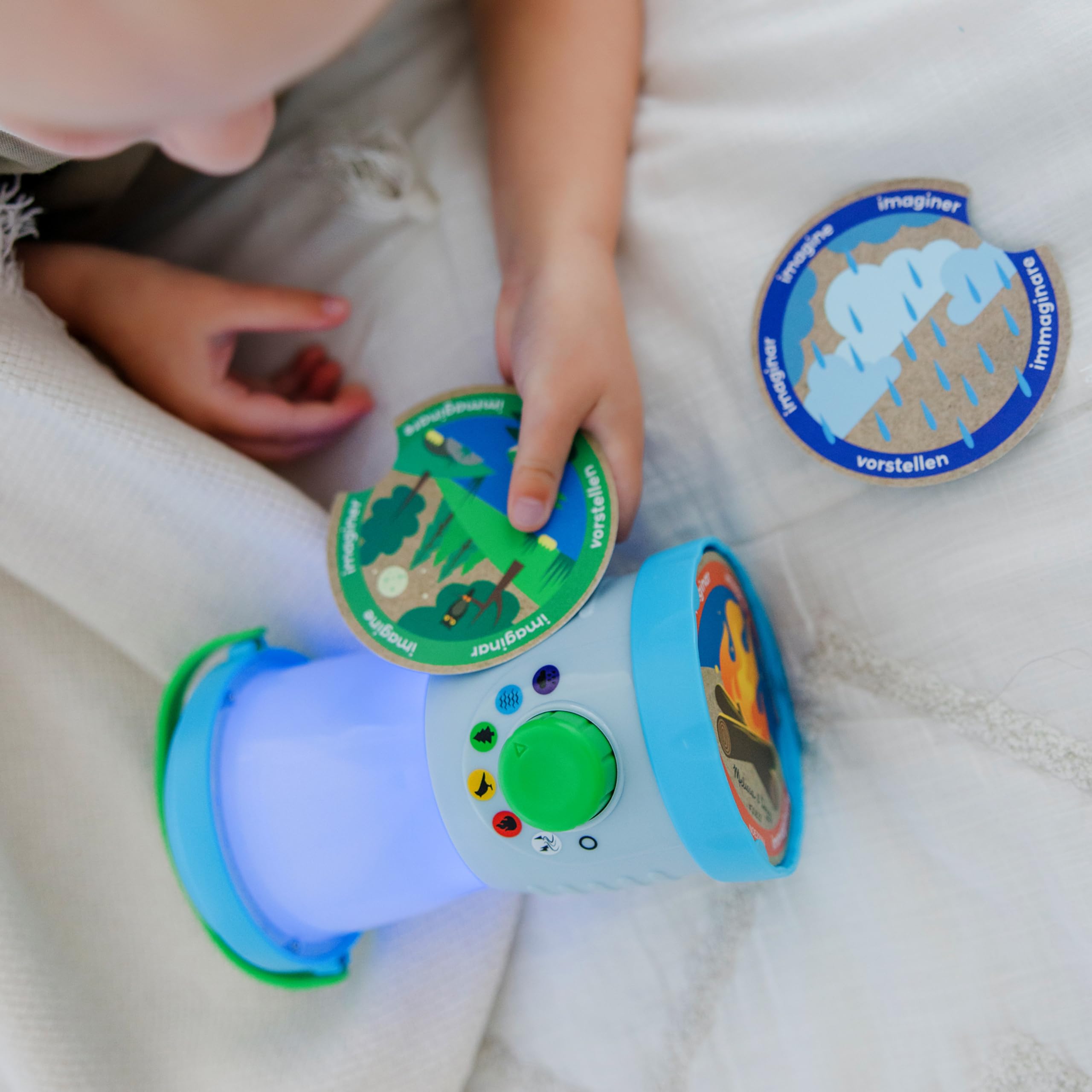 Melissa & Doug Let’s Explore Light & Sound Camping Lantern Play Set, lantern, 3 double-sided cards to set the scene (cards store in bottom of lantern), collectible medallion