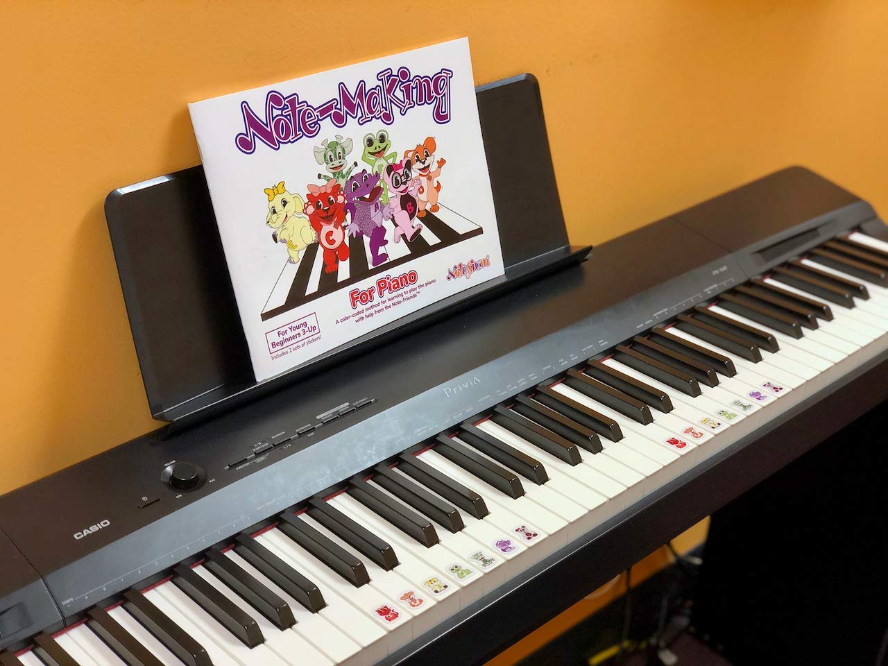 Note-Making for Piano: A color-coded piano book for kids with Note-Friend piano stickers.