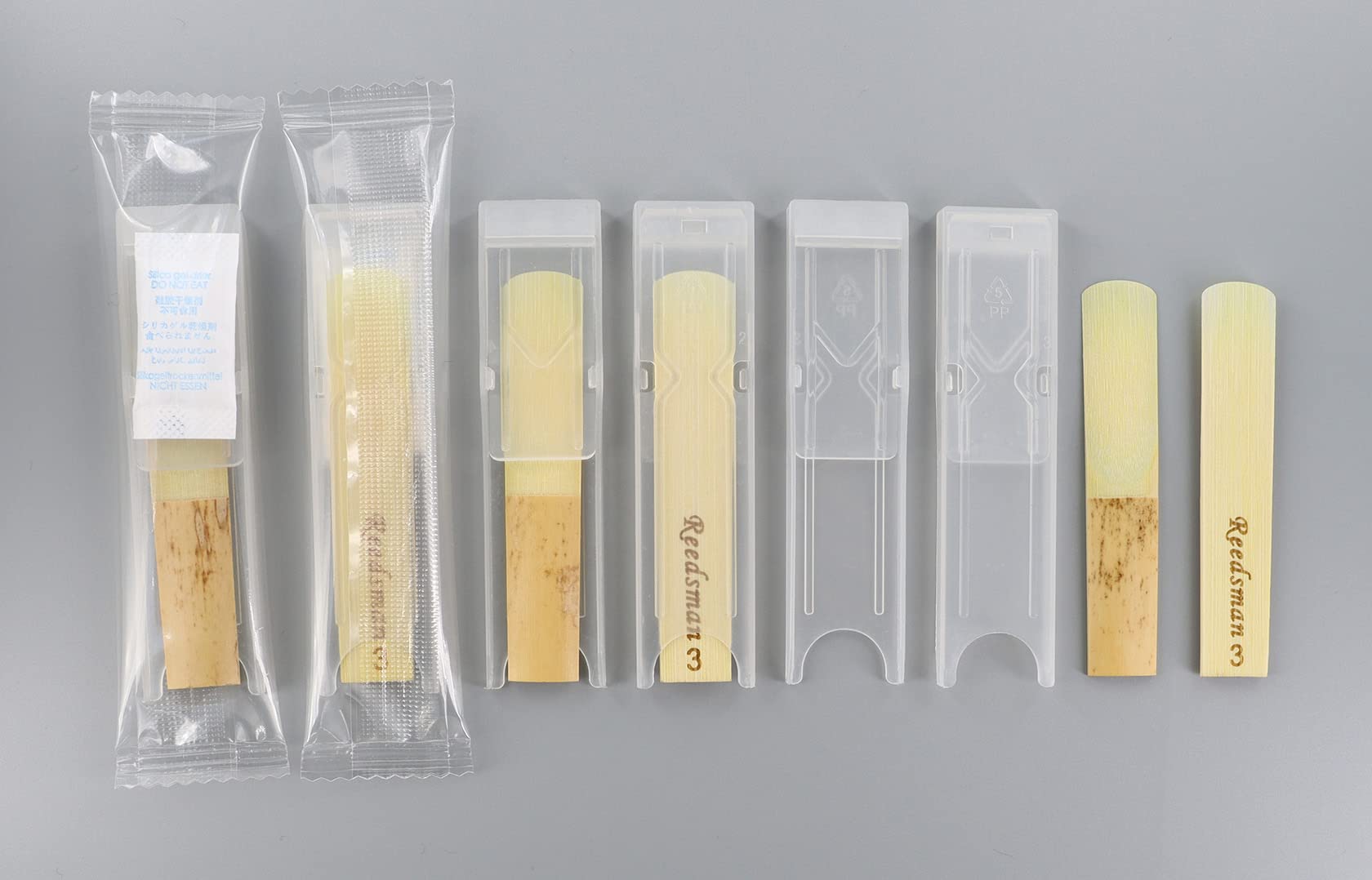 Reedsman Traditional Bb Clarinet Reeds, Includes 10 Plus 2 Total 12 Pack Reeds With Individual Reed Holders and One Mini Harmonica. (Strength 3.0)