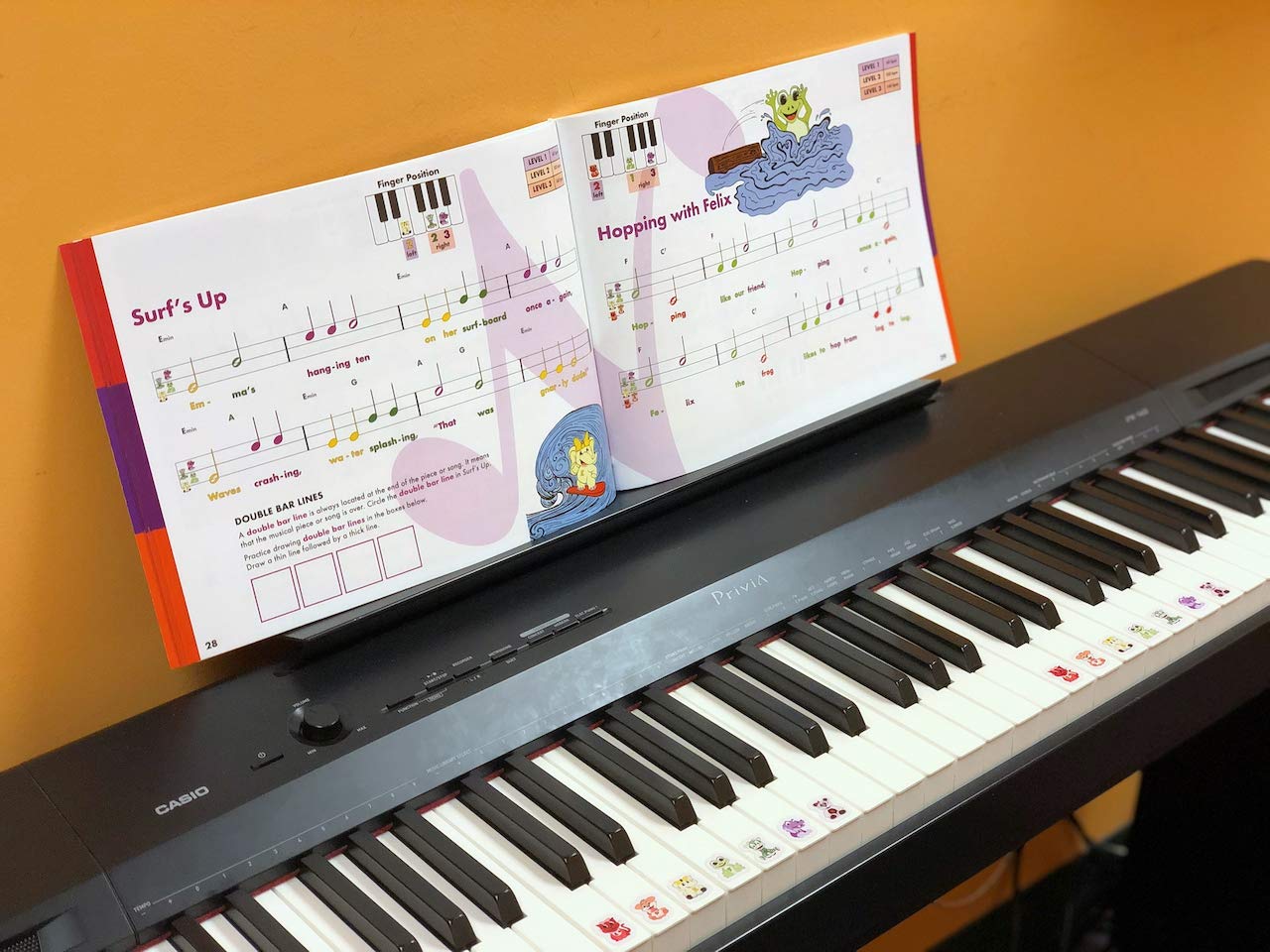 Note-Making for Piano: A color-coded piano book for kids with Note-Friend piano stickers.
