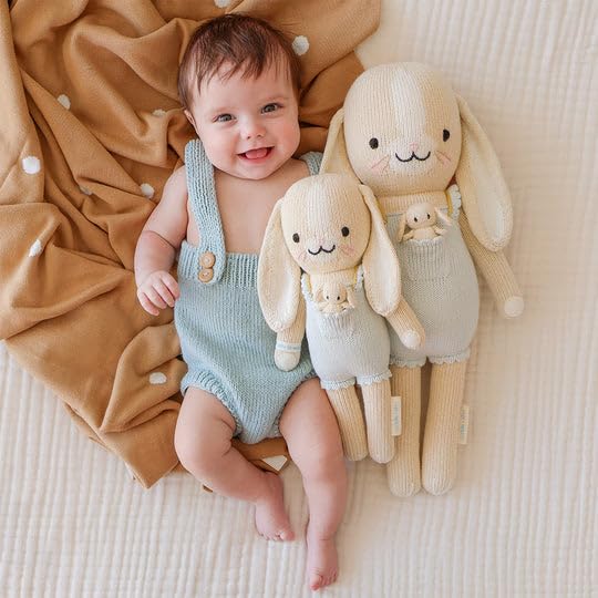 cuddle + kind Briar The Bunny Little 13" Hand-Knit Doll β 1 Doll = 10 Meals, Fair Trade, Heirloom Quality, Handcrafted in Peru, 100% Cotton Yarn