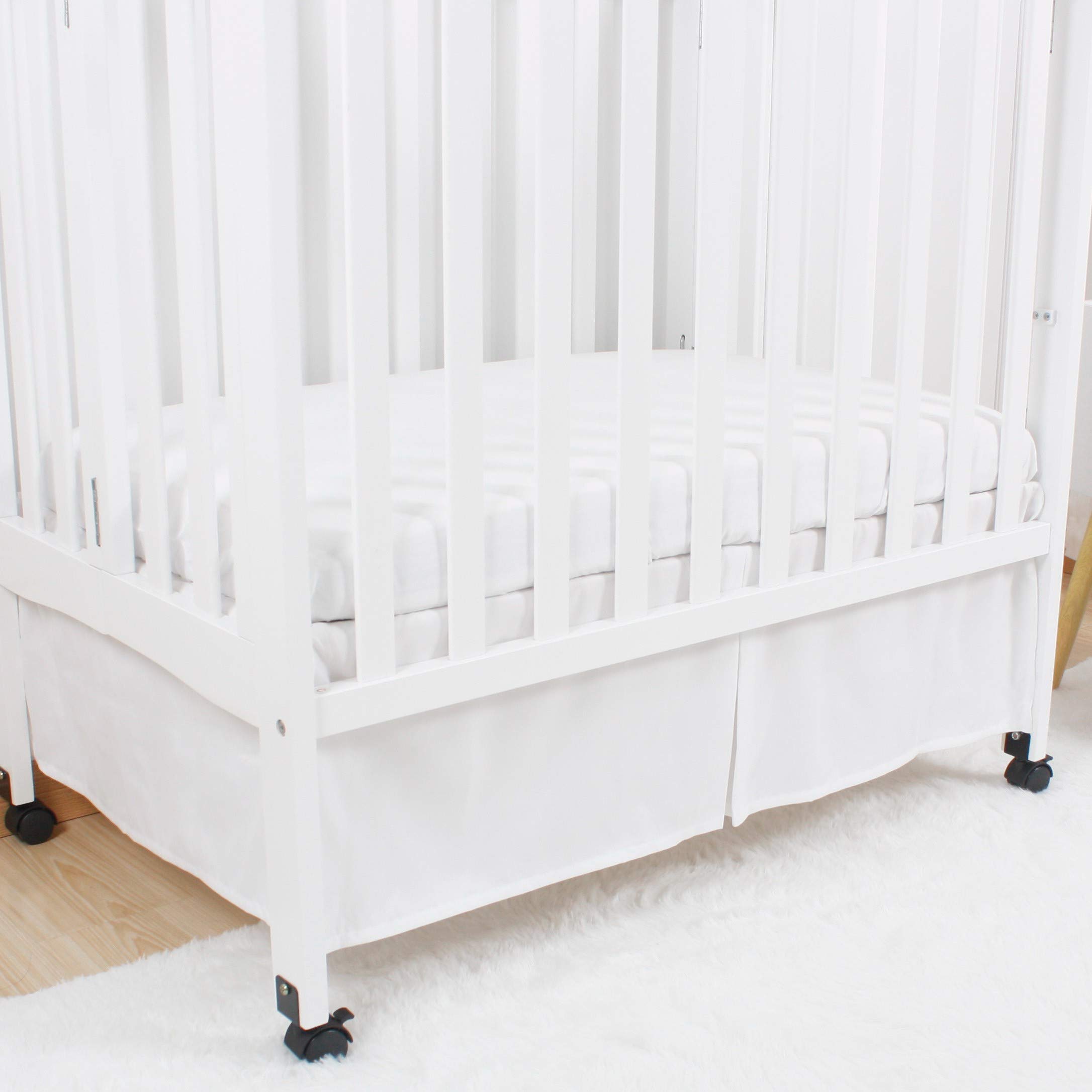 CaSaJa Mini Crib Skirt Pleated, Silk-Looking Soft Microfiber Baby Bed Skirt with Durable Platform for Mini and Portable Cribs 24" X 38", 12" Generous Drop Dust Ruffle, Machine Washable, White Color