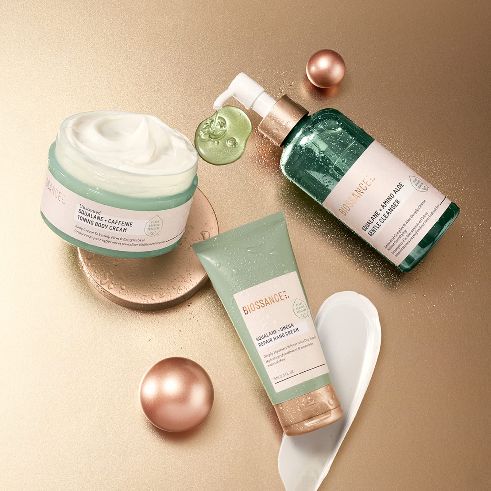 Biossance Daily Decadence Set. Full Size Squalane + Amino Aloe Gentle Cleanser (6.7 oz) with Omega Repair Hand Cream (2.5 oz) and Unscented Caffeine Toning Body Cream (6.7 oz)