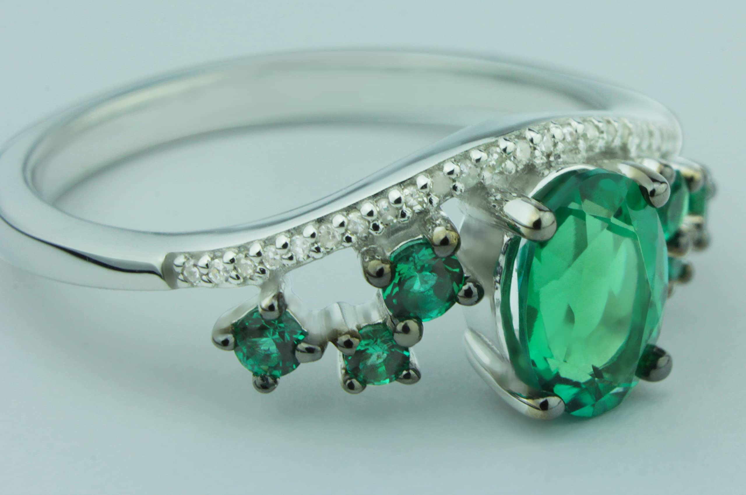 Belantina Heartland By Beverley Mitchell .925 Sterling Silver 7x5mm Oval Cut Lab-Created Emerald & Diamond Accented Curved Statement Ring (H-I, I2-I3) - Size 7