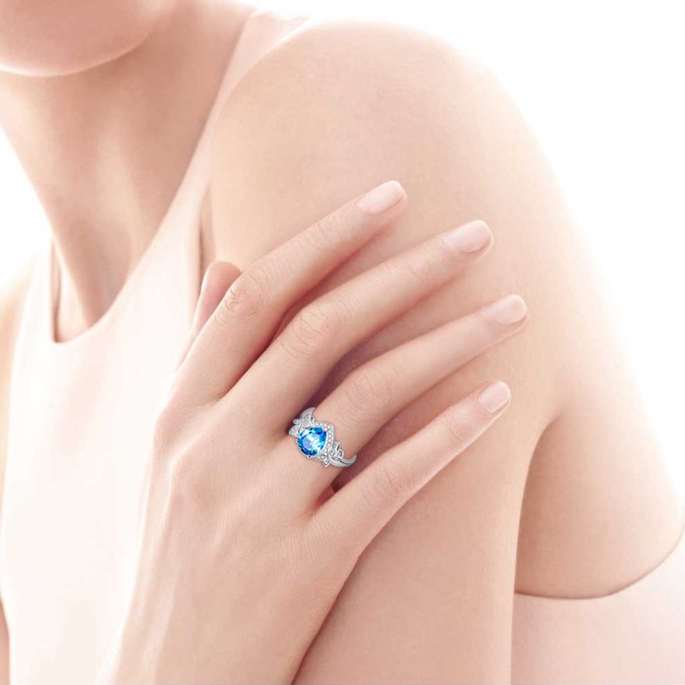 BONLAVIE 3.85ct Created 10 * 8mm Pear Cut Swiss Blue Topaz Ring with CZ Halo Butterfly Teardrop Stackable 925 Sterling Silver Engagement Rings Created Sapphire Rhinestone Ring for Women Size 6