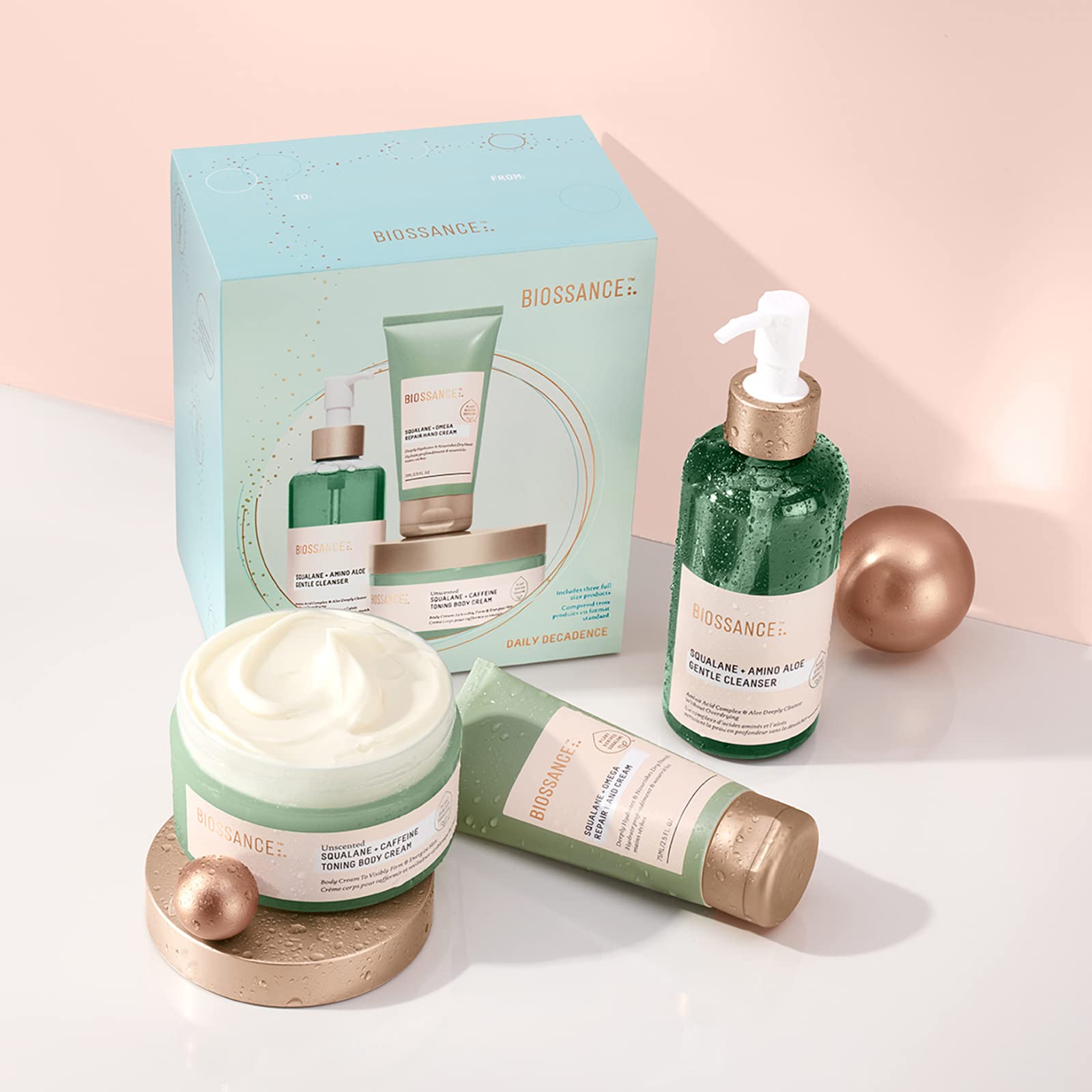 Biossance Daily Decadence Set. Full Size Squalane + Amino Aloe Gentle Cleanser (6.7 oz) with Omega Repair Hand Cream (2.5 oz) and Unscented Caffeine Toning Body Cream (6.7 oz)