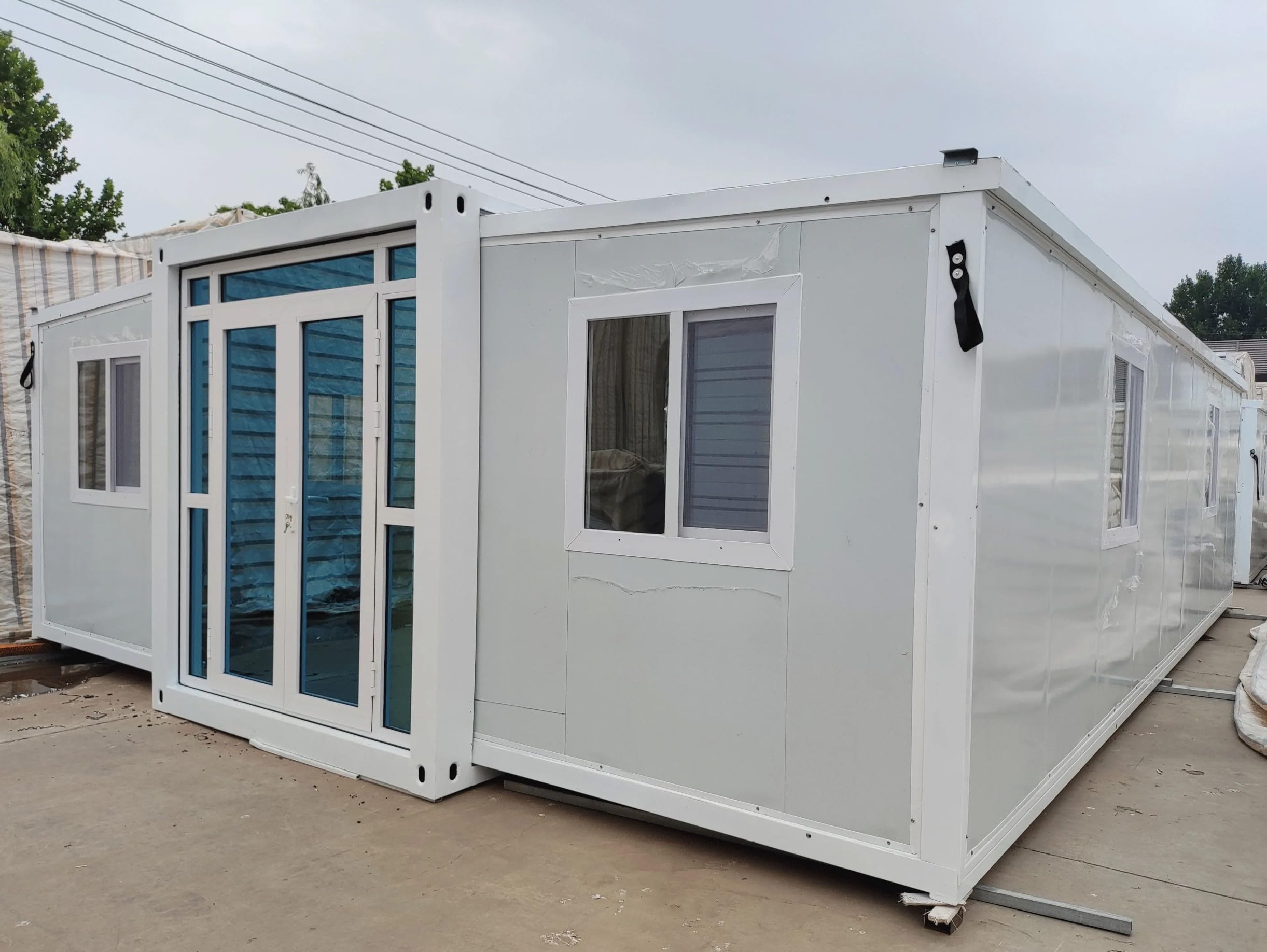 Generic Manufacturer 40FT Homes prefab Steel Expandable Container Houses Extendable Foldable Container House Including bedrooms, Kitchen, Bathroom and a Free TV
