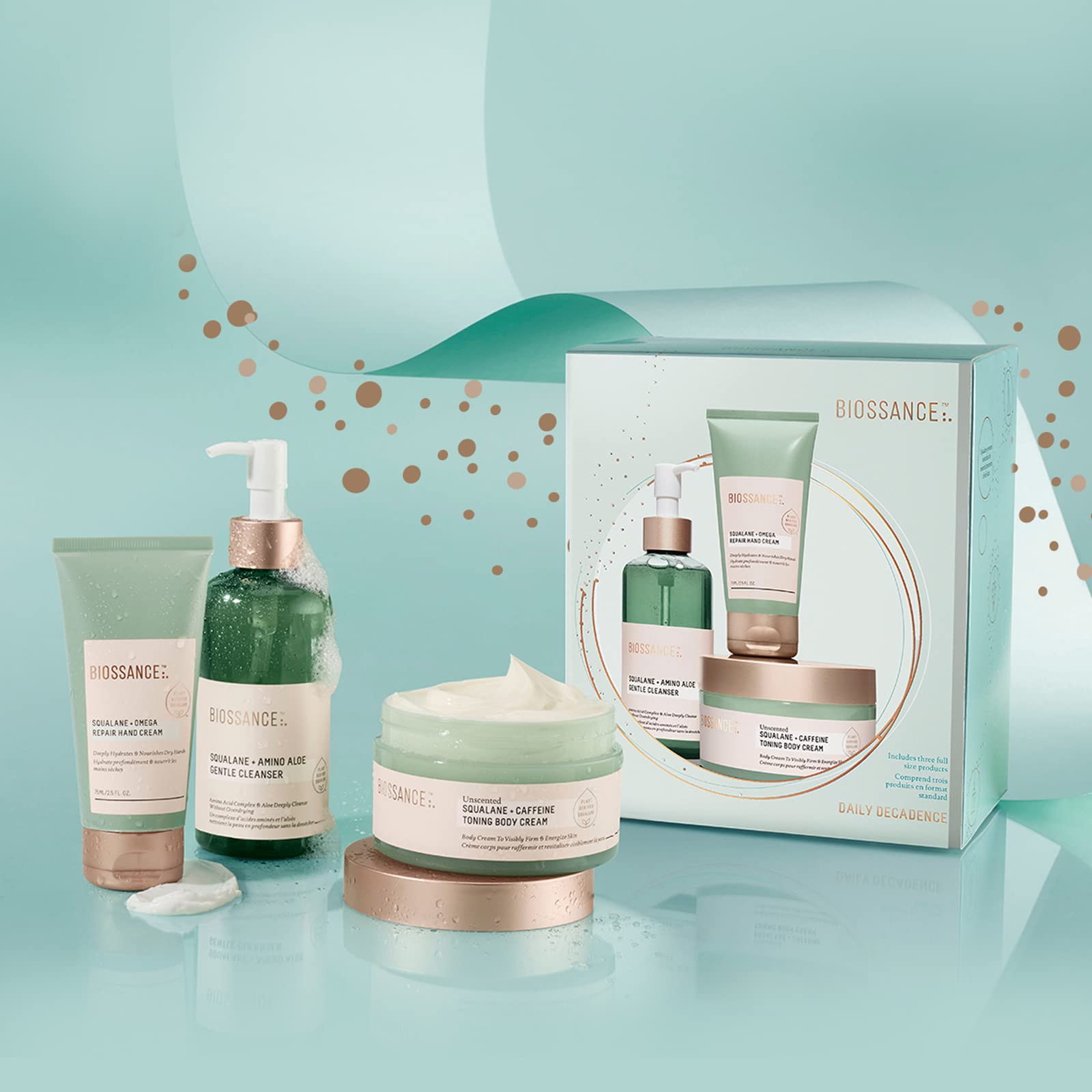 Biossance Daily Decadence Set. Full Size Squalane + Amino Aloe Gentle Cleanser (6.7 oz) with Omega Repair Hand Cream (2.5 oz) and Unscented Caffeine Toning Body Cream (6.7 oz)