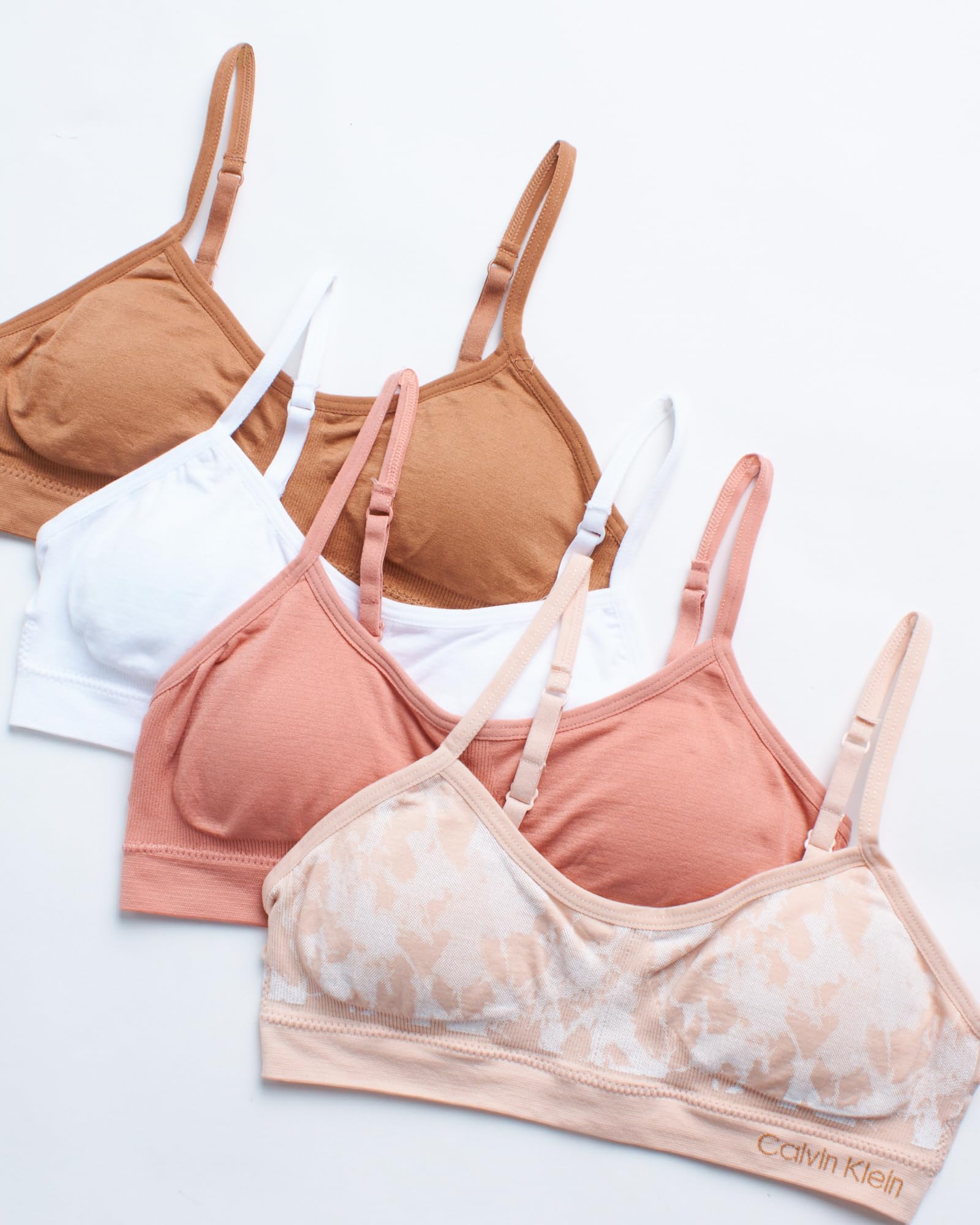 Calvin Klein Girls' Training Bra - 4 Pack Seamless Crop Cami Bralette, Removable Pads (S-L), Size Large, Buff/Rose Dawn/White/Bronze