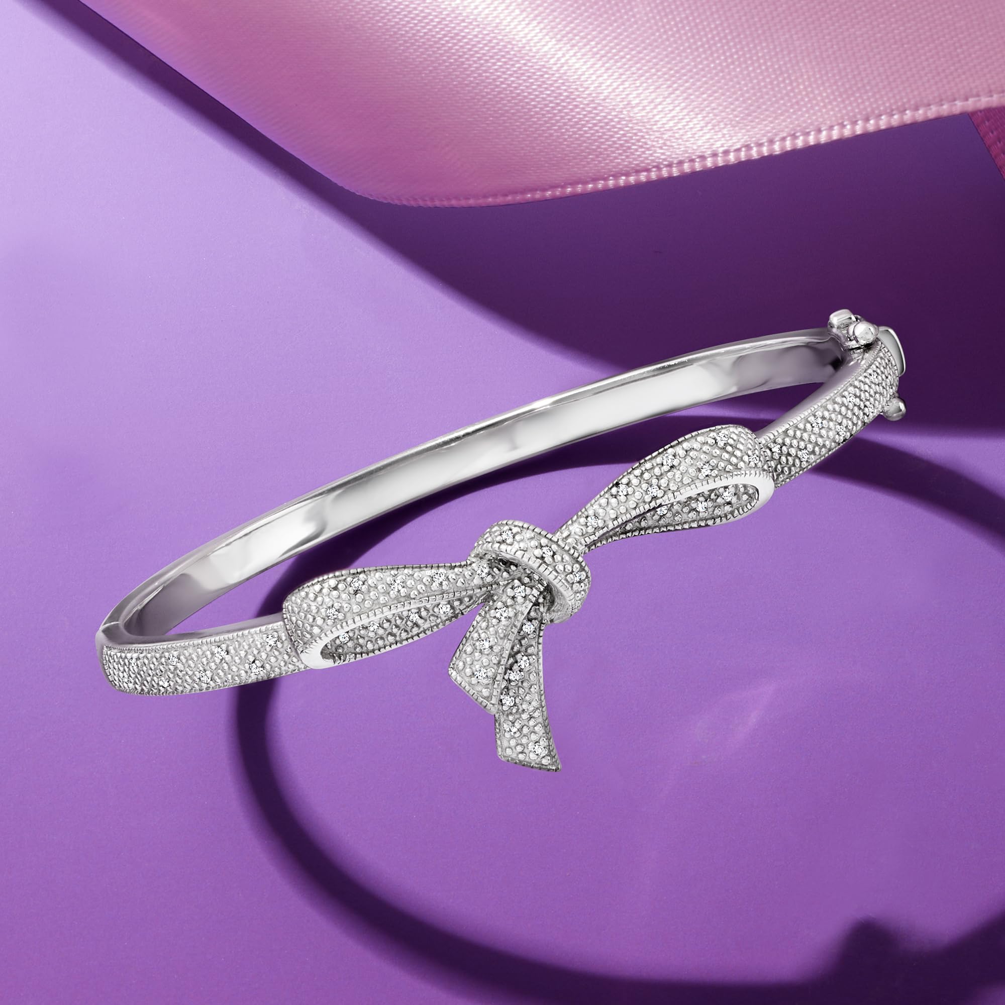 Ross-Simons 0.15 ct. t.w. Diamond Bow Bangle Bracelet in Sterling Silver. 7 inches