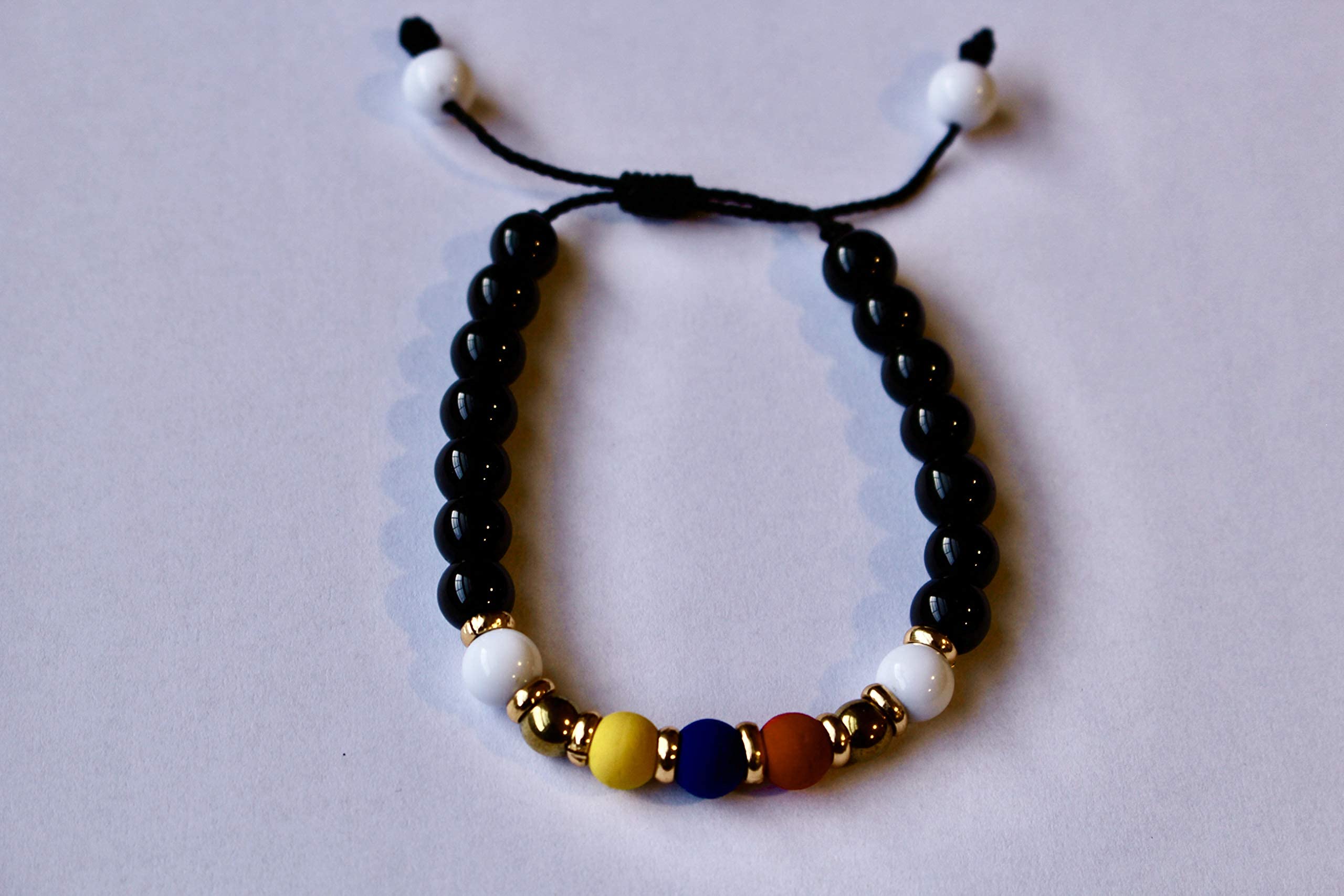 CharmsOfTheWorld Handmade Bracelet from Medellin - Colombia Flag Colors - Cat's eye gemstone and steel beads - Sliding Knot