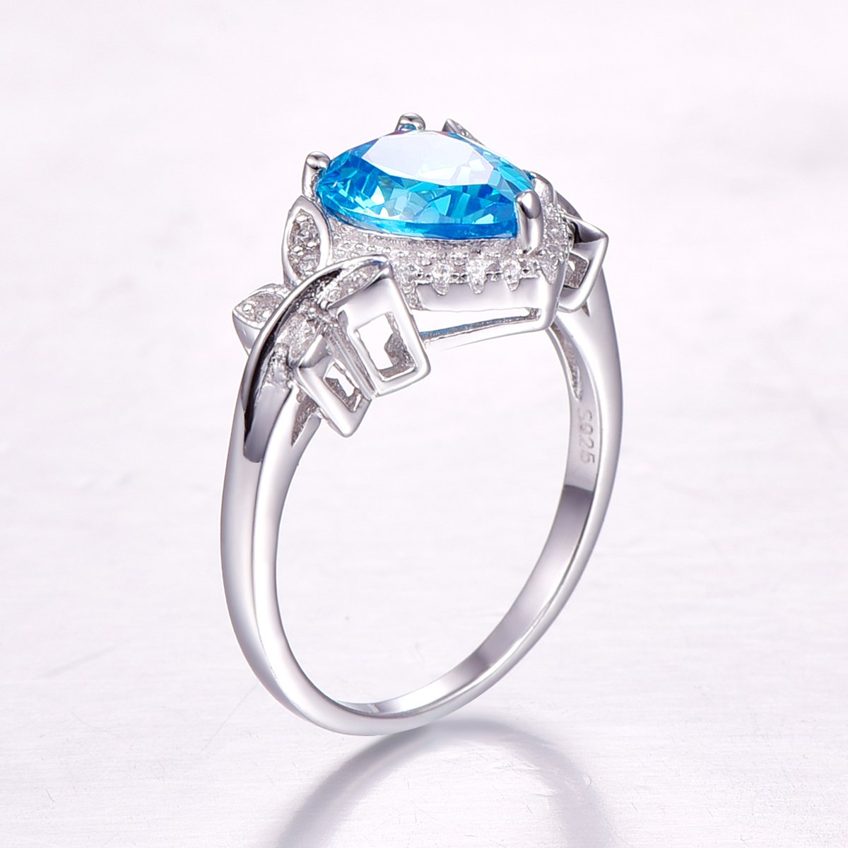 BONLAVIE 3.85ct Created 10 * 8mm Pear Cut Swiss Blue Topaz Ring with CZ Halo Butterfly Teardrop Stackable 925 Sterling Silver Engagement Rings Created Sapphire Rhinestone Ring for Women Size 6