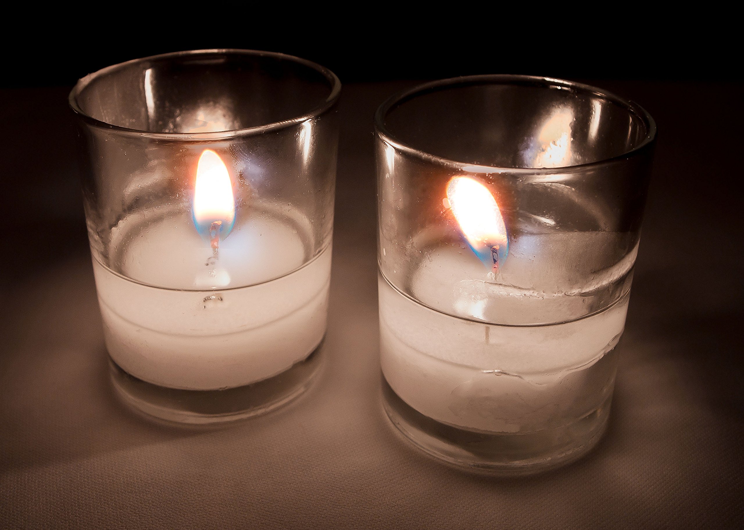 Harmonic Blossom Glass Votives - Premium White Unscented Votive Candles in Clear Elegant Holders - 15 Hour Long Lasting Burn Time - for Weddings, Parties and Event Decoration Centerpieces (12 Pack)
