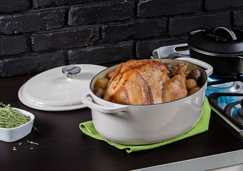 Lodge 7 Quart Enameled Cast Iron Oval Dutch Oven with Lid – Dual Handles – Oven Safe up to 500° F or on Stovetop - Use to Marinate, Cook, Bake, Refrigerate and Serve – Oyster White