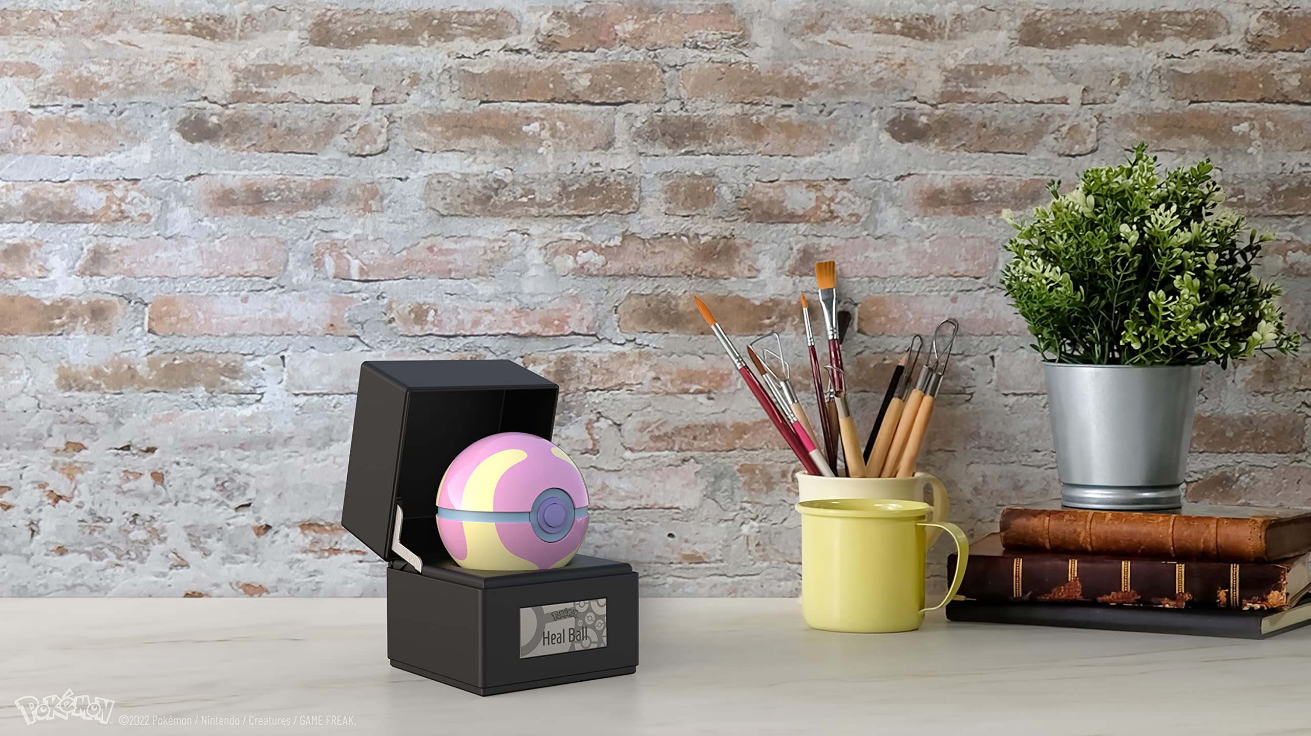 Pokémon Poké Ball Authentic Replicas - Realistic, Electronic, Die-Cast Poké Ball with Display Case Light Features - by The Wand Company (Heal Ball)