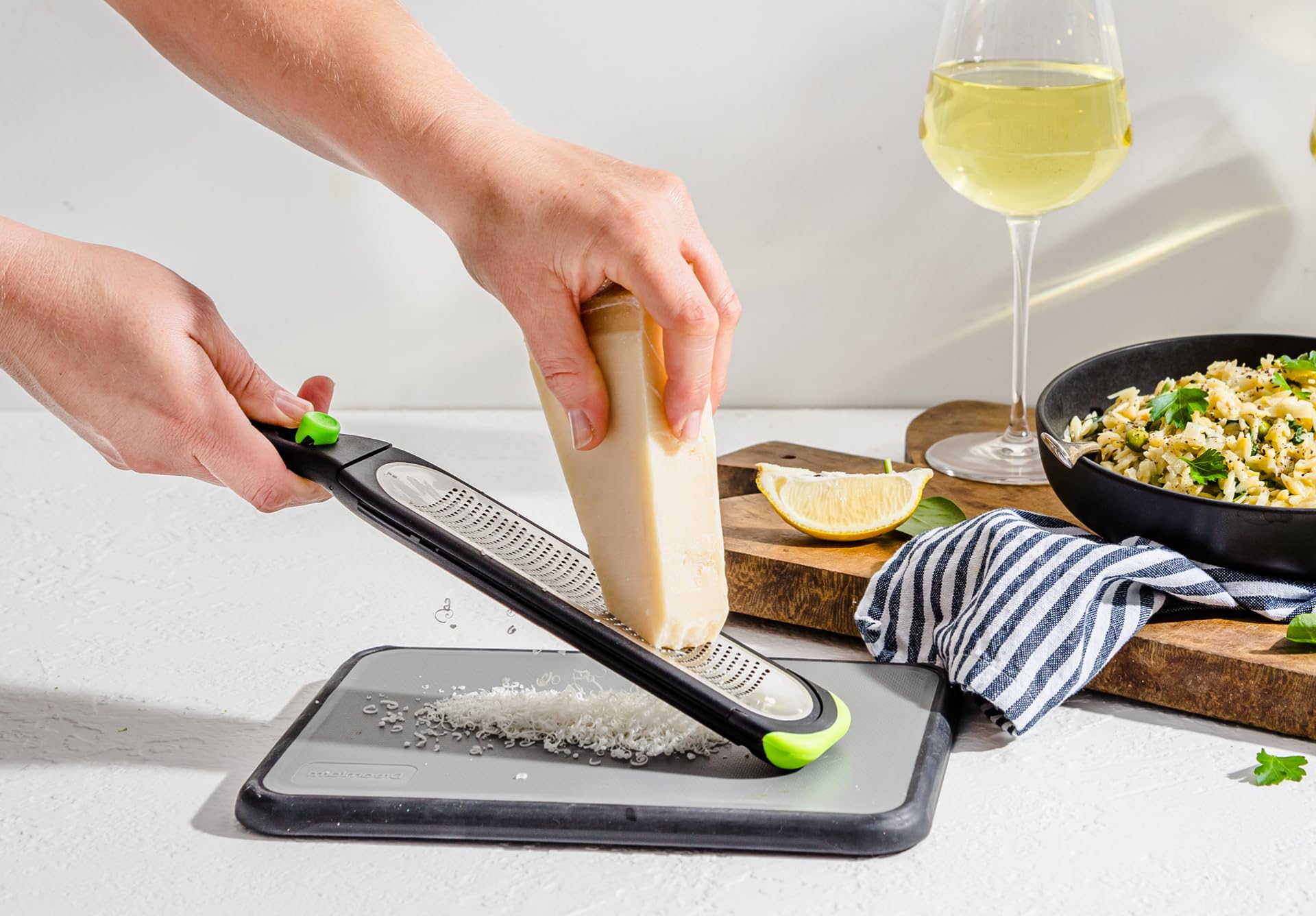 Dreamfarm Ozest Self-Cleaning POP-Button Zester for Fine, Fluffy Citrus Zest, Cheese, Nut, & Spices with Non-Slip Silicone Foot - 1mm Zester, Black/Green