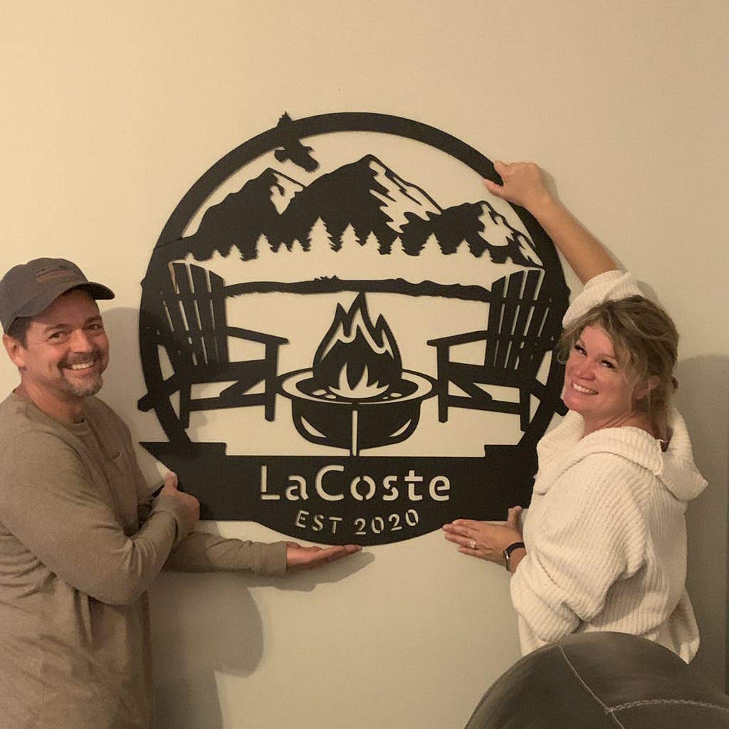 RealSteel Personalized Campfire Name Sign - Custom Metal Wall Art with Adirondack Chairs, Mountains, and Campfire Scene - Rustic Cabin, RV, and Campsite Decor - Gift for Campers & Nature Lovers - Black, 18"
