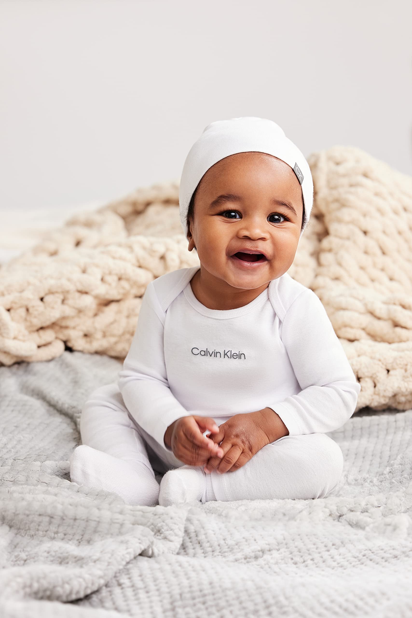 Calvin Klein Organic Unisex Baby Essentials 4-Piece Set with Long Sleeve Tee & Pants, Ultra-Soft Beanie & Socks Included, Bright White