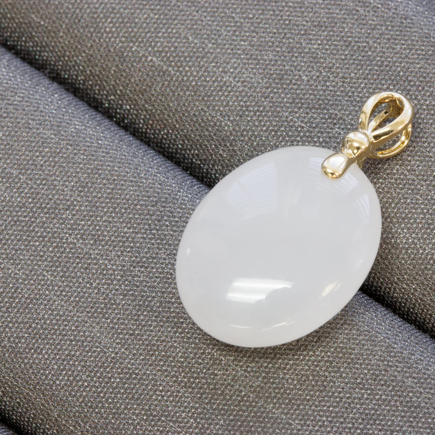 CHOW TAI FOOK Oval Shape Heitian Jade Pendant with 18K Yellow Gold Claws Prong