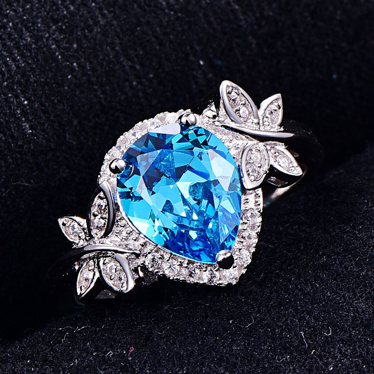 BONLAVIE 3.85ct Created 10 * 8mm Pear Cut Swiss Blue Topaz Ring with CZ Halo Butterfly Teardrop Stackable 925 Sterling Silver Engagement Rings Created Sapphire Rhinestone Ring for Women Size 6