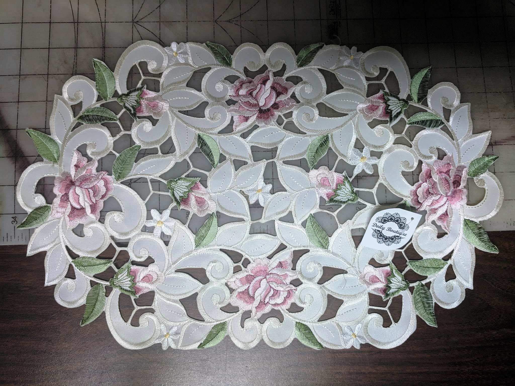 Doily Boutique Place Mat or Doily with a Light Pink Cutwork Rose, Size 11 x 17 inches