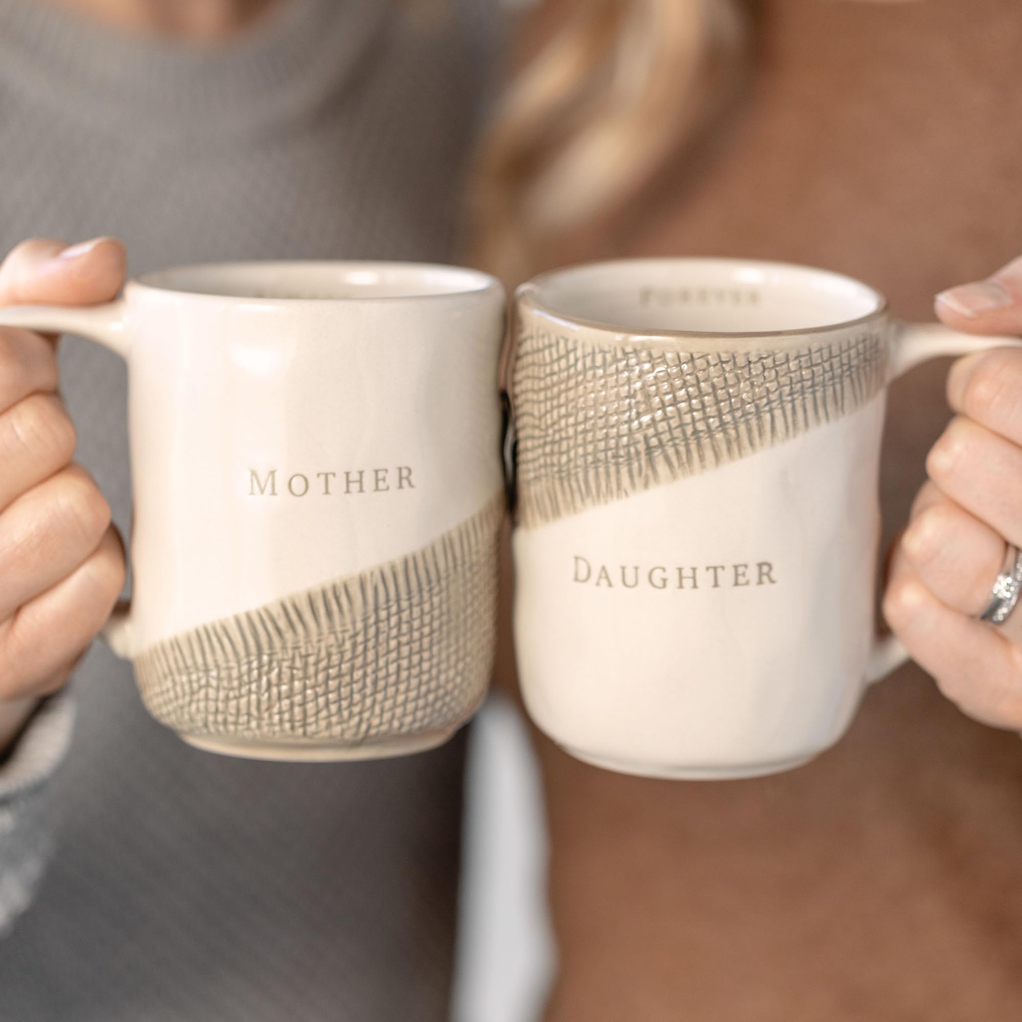 DEMDACO Mother and Daughter Hug Glossy Cream 12 ounce Stoneware Ceramic Mugs Set of 2