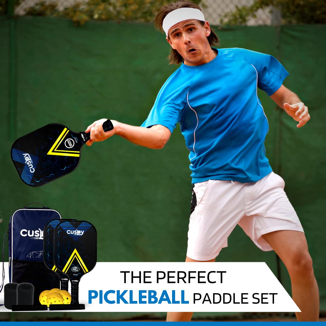 Cuspy USAPA Pickleball Paddles Set of 2 – includes 2 Pickleball Paddles with sturdy Graphite Surface and trendy Dark Blue color, 4 Balls, 2 Extra Grip Tapes, 2 Wristbands, and a durable Pickleball Bag