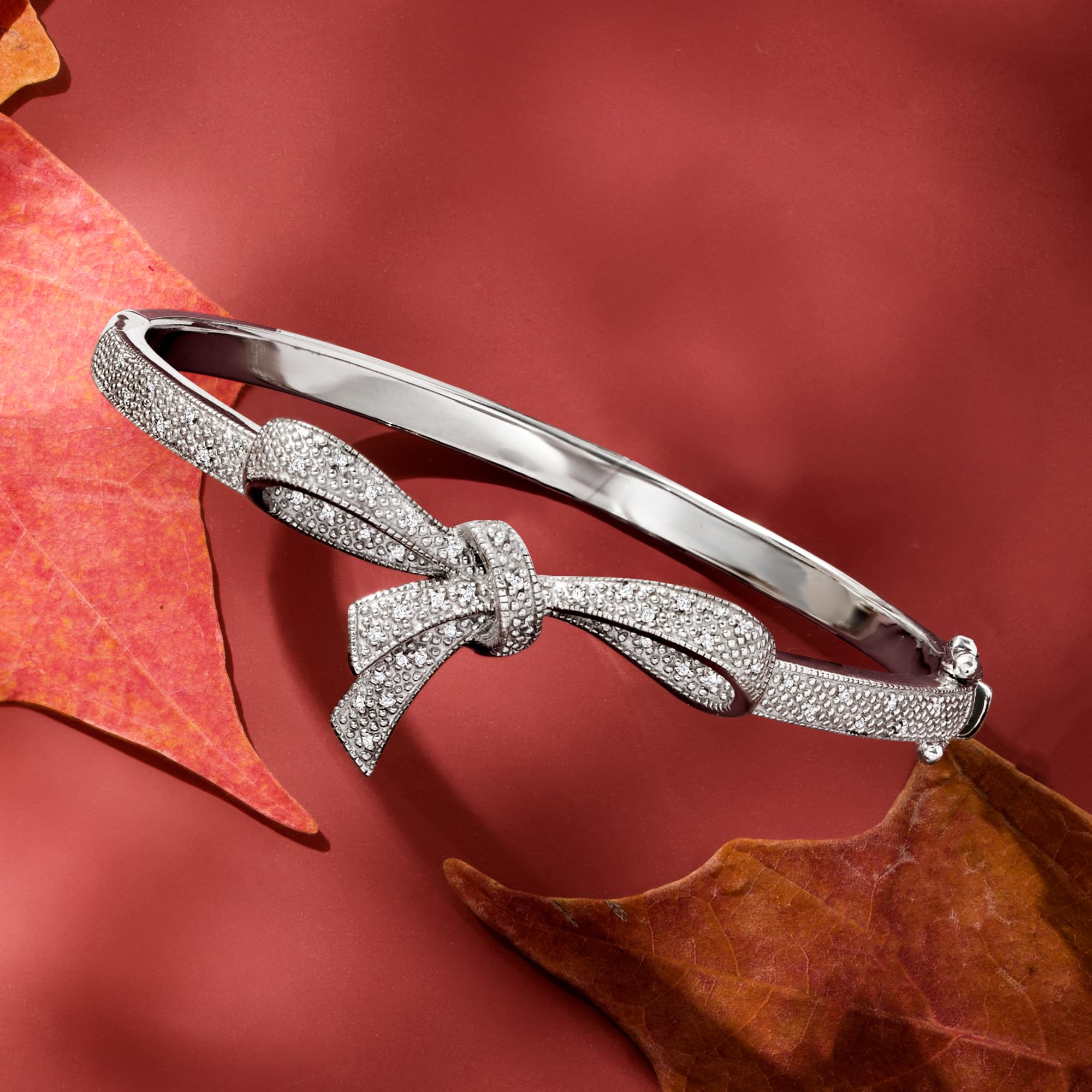Ross-Simons 0.15 ct. t.w. Diamond Bow Bangle Bracelet in Sterling Silver. 7 inches