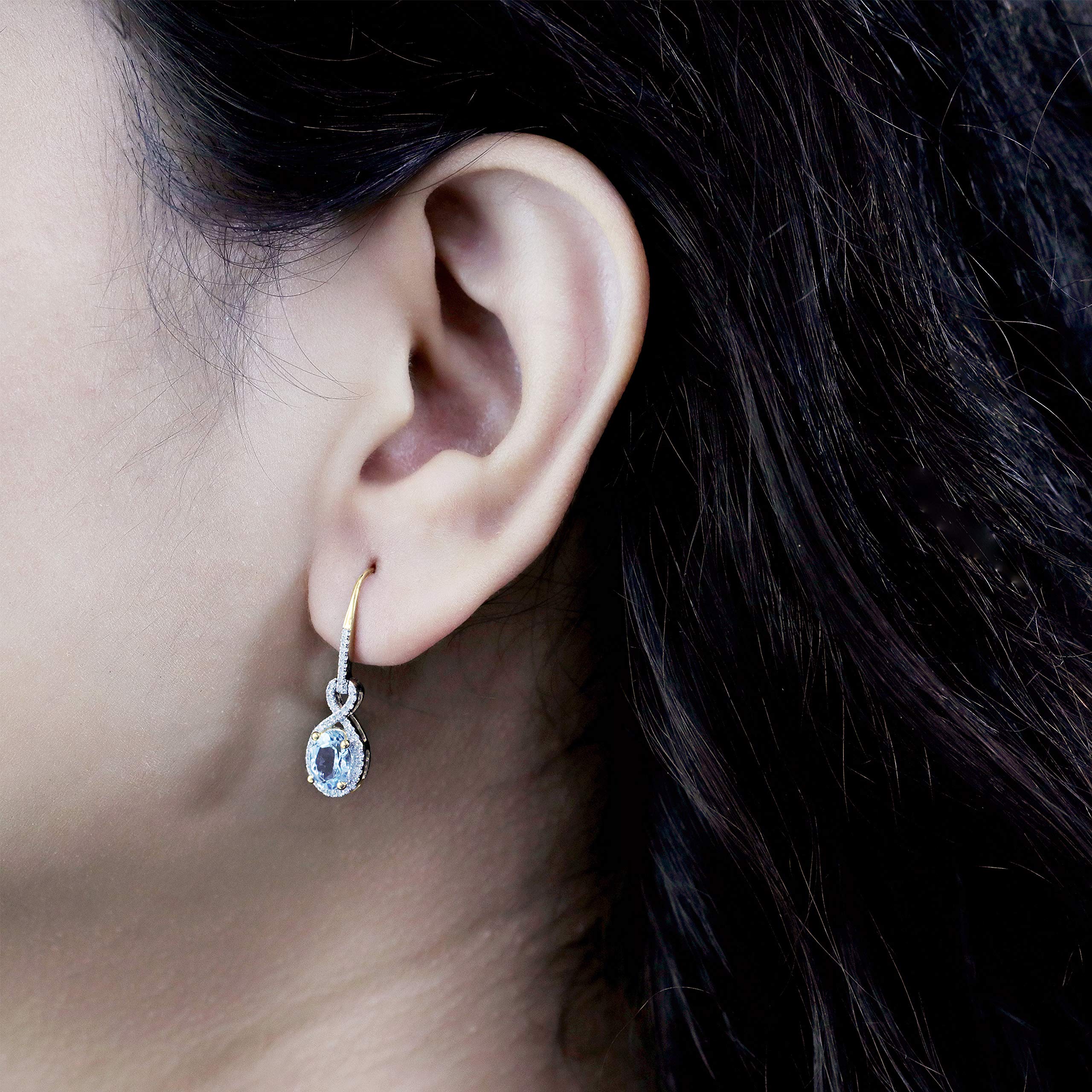Dazzlingrock Collection 10K Oval Aquamarine & Round White Diamond Ladies Infinity Dangling Earrings, Yellow Gold