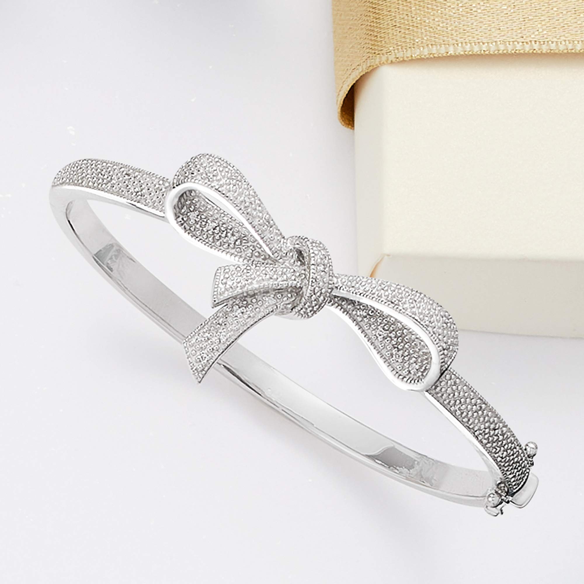 Ross-Simons 0.15 ct. t.w. Diamond Bow Bangle Bracelet in Sterling Silver. 7 inches